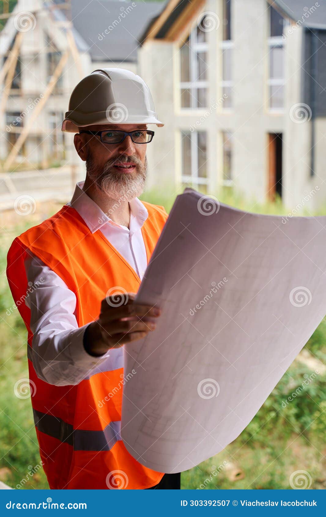 Construction Foreman Using Blueprints on Building Site Stock Image ...