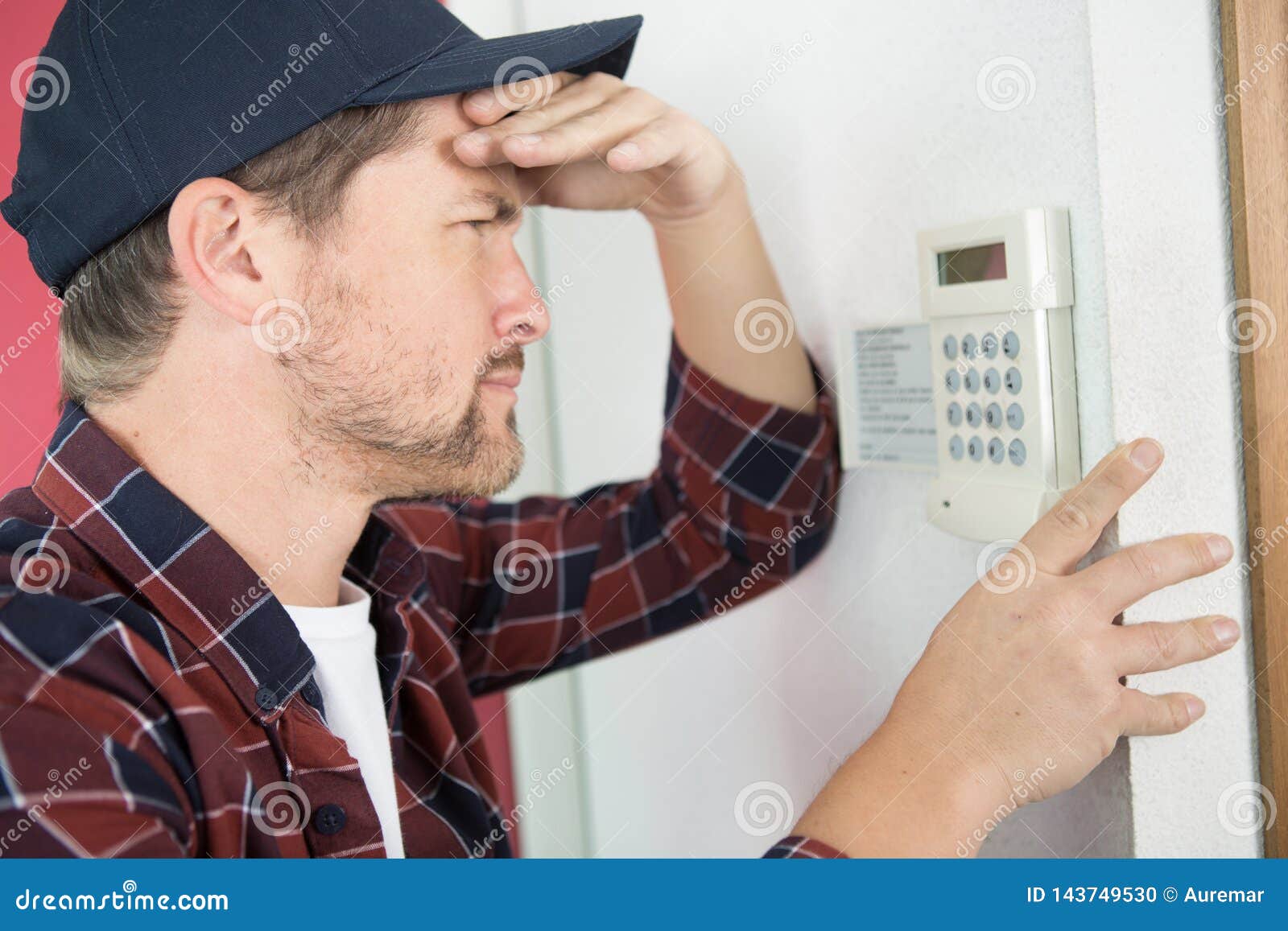 Contractor with Confused Expression Using Electronic Keypad Stock Photo ...
