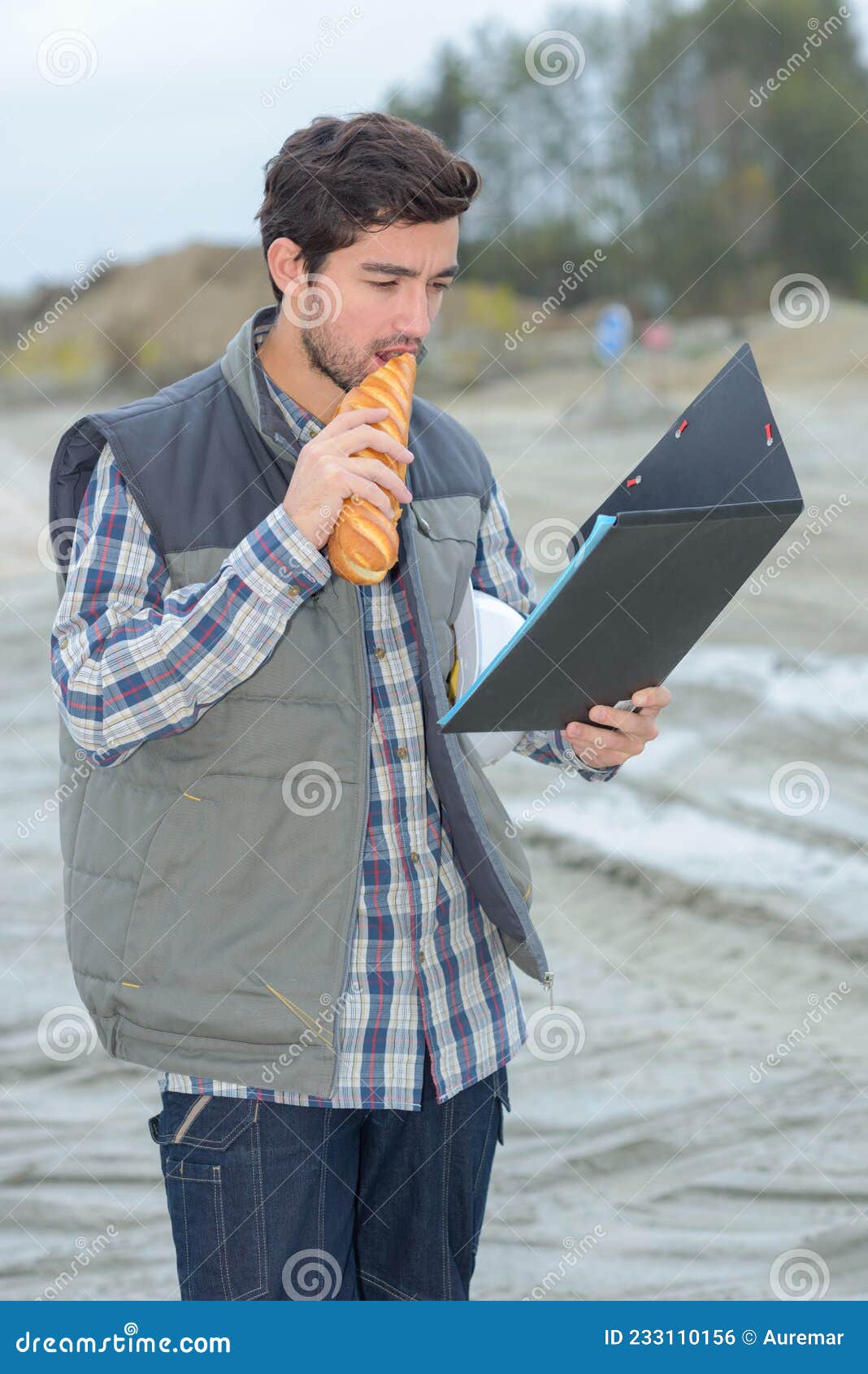 Contractor on Construction Site Eating Baguette Sandwich Stock Photo ...