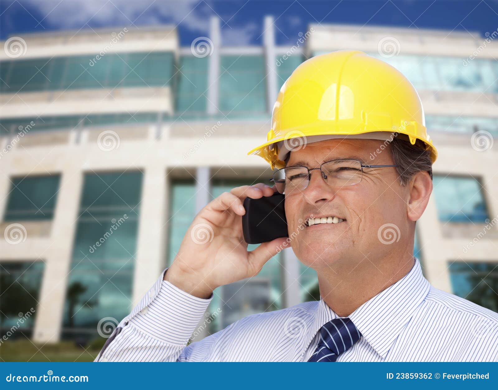 Contractor in Hardhat Talks on Phone in Front of Building Stock Photo ...
