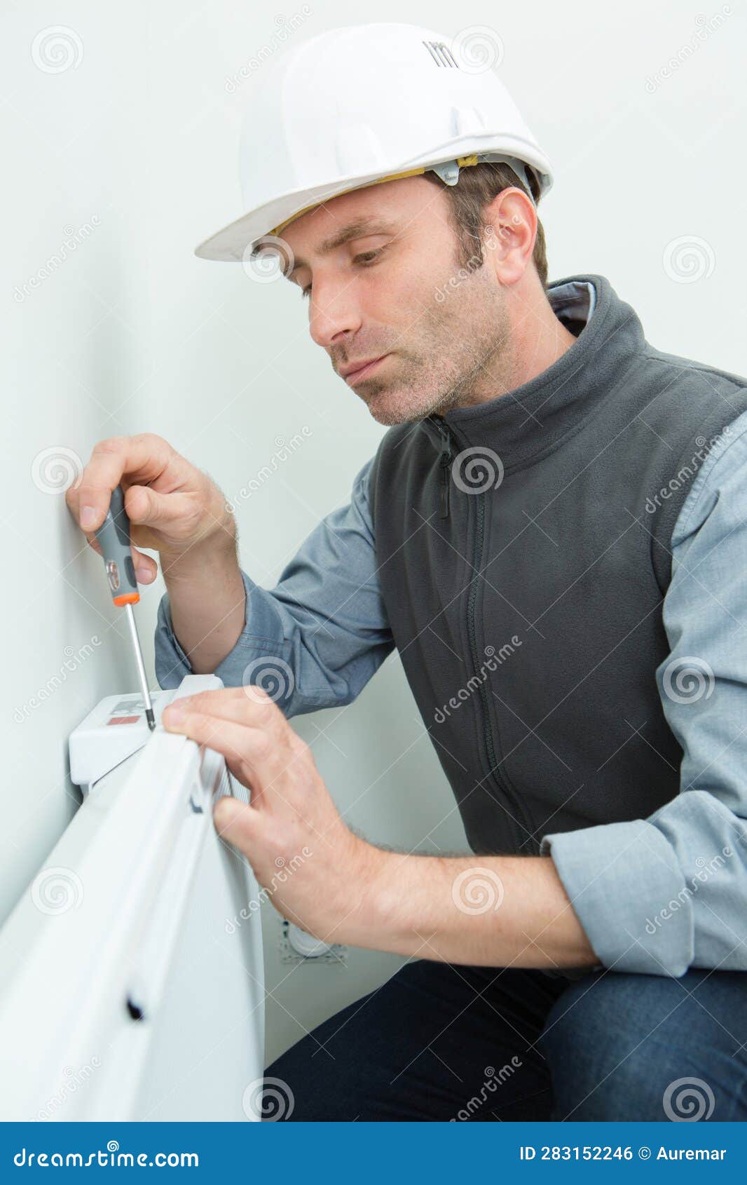 Contractor Installing Electric Wall Heater Stock Photo - Image of ...