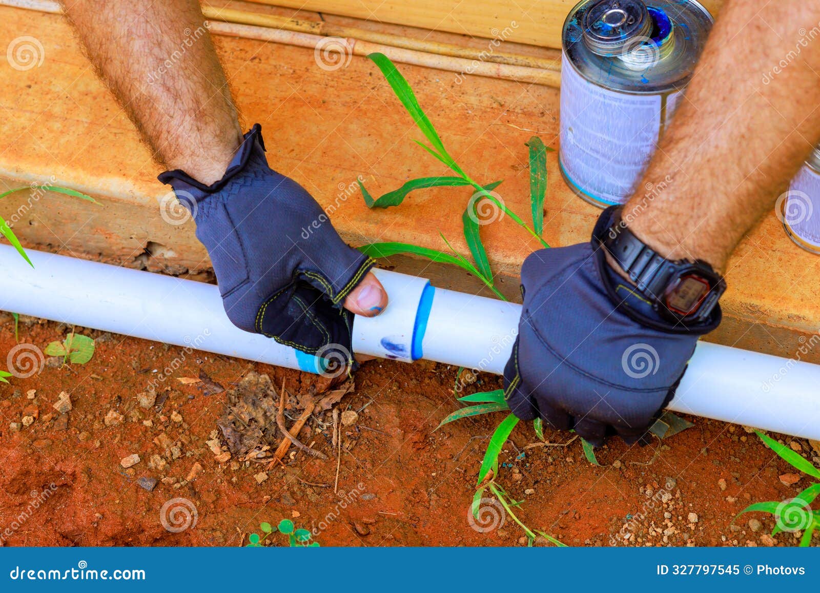 Contractor Installing Glues Plastic PVC Pipes for Laying a Water ...