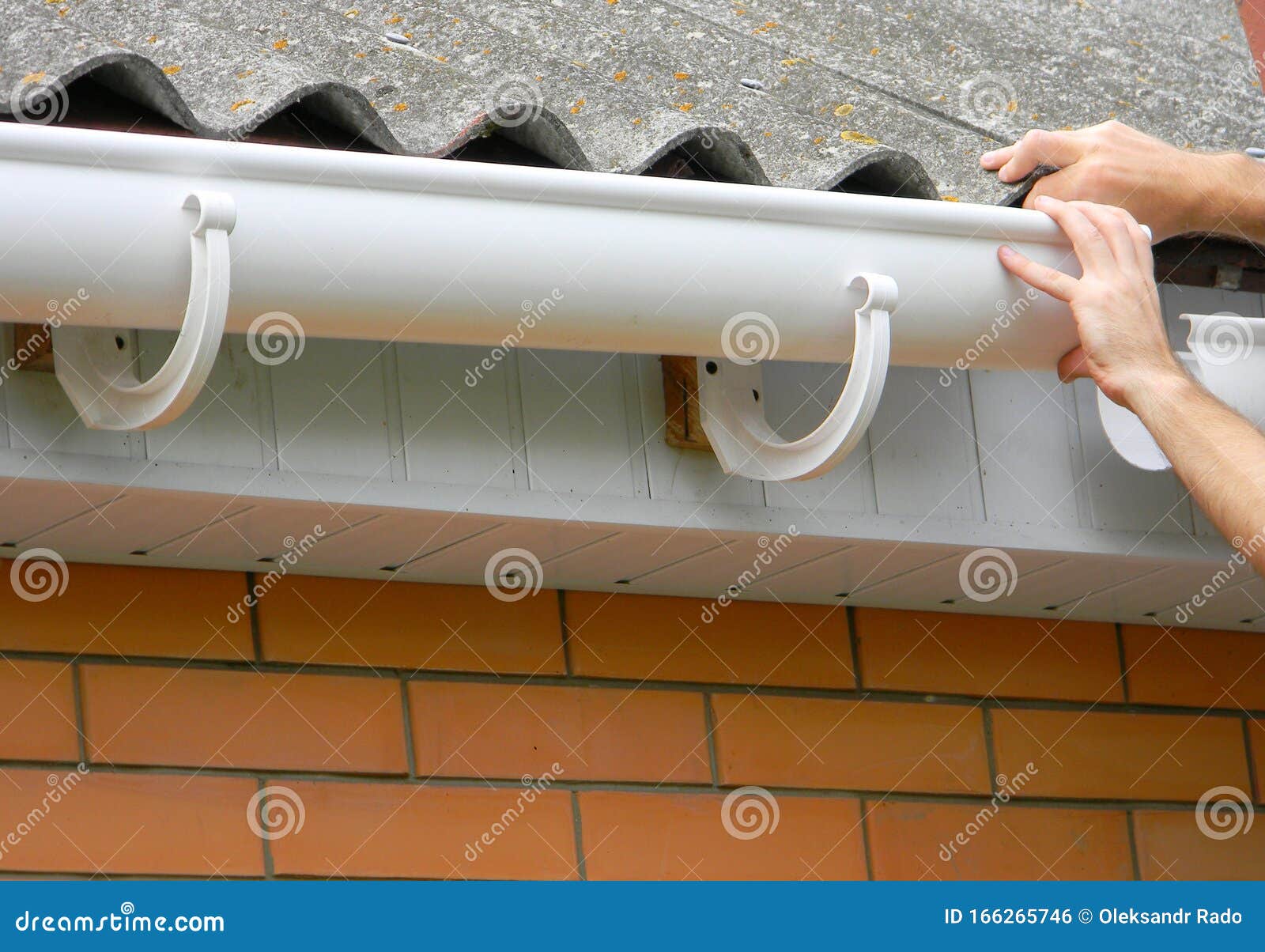Man Installing Plastic Rain Gutter System Pipeline. Guttering, Gutters ...