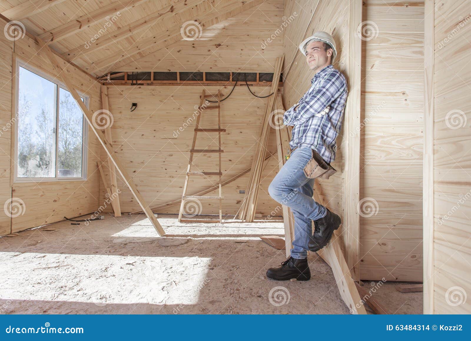Contractor Leaning Against Wooden Wall Stock Photo - Image of ...