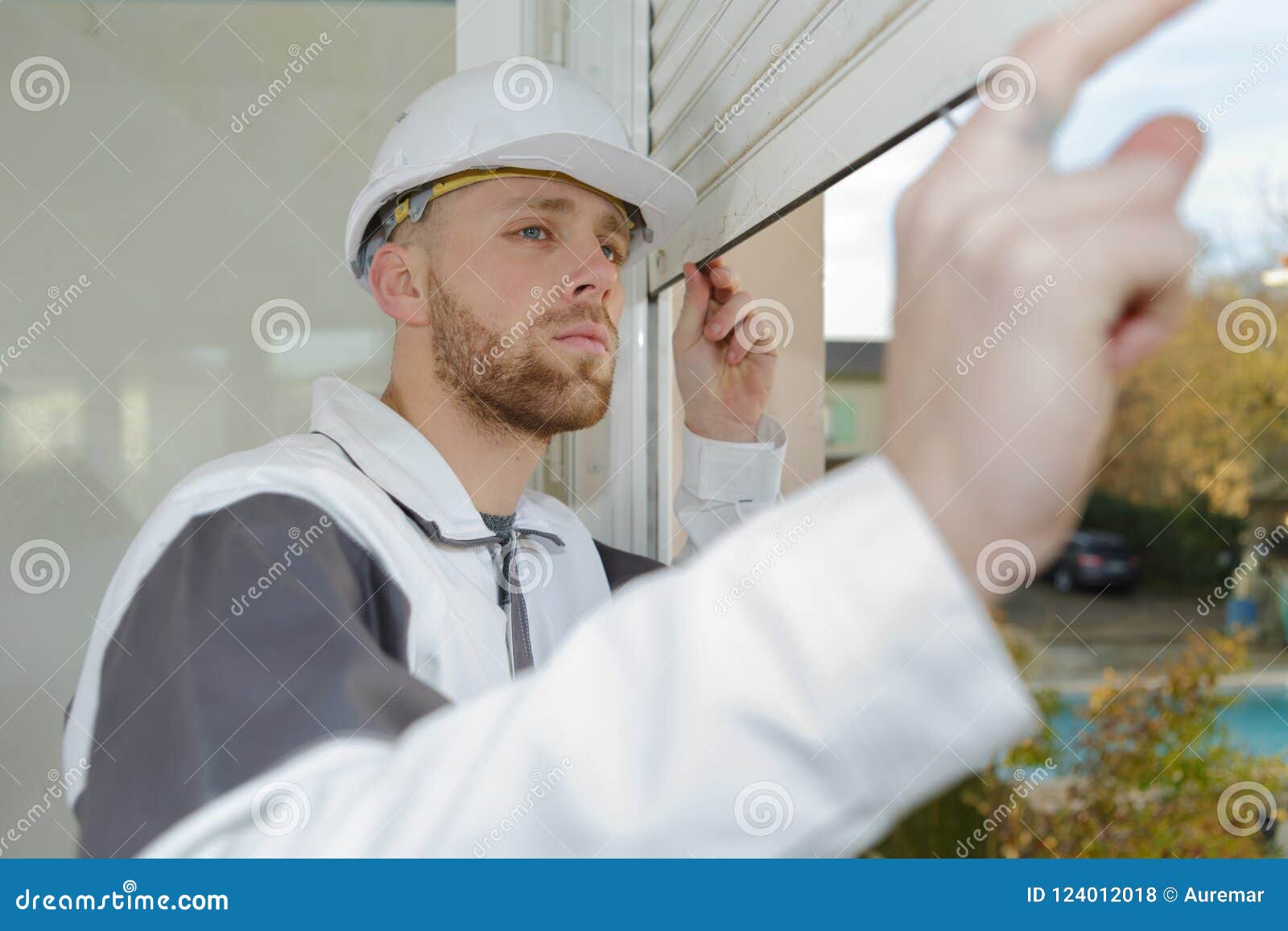 Contractor Looking at Window Roller Shutter Stock Photo - Image of ...