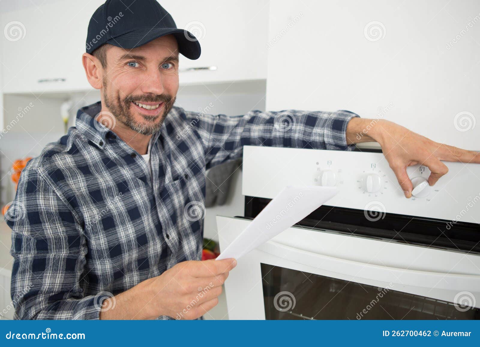 Contractor Reading Instructions for New Oven Stock Photo - Image of ...