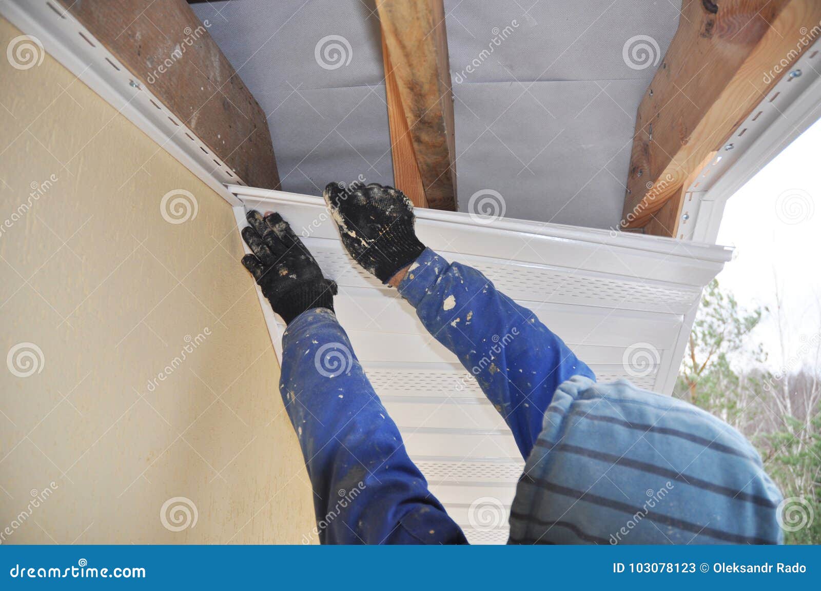 Contractor, Roofer Installing Soffit. Roofing Construction. Soffit and ...