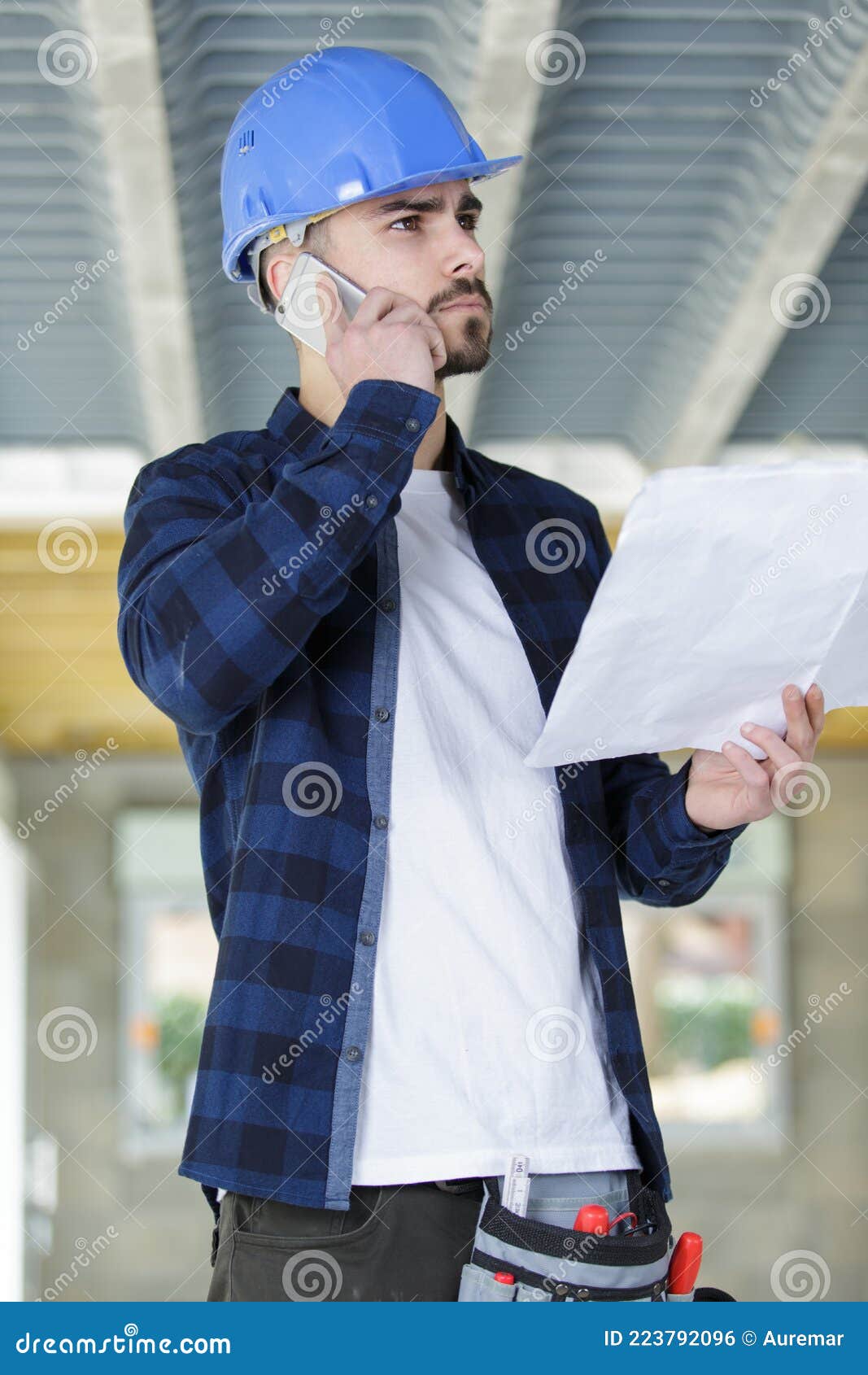 Contractor on Site Holding Plans and Making Telephone Call Stock Photo ...