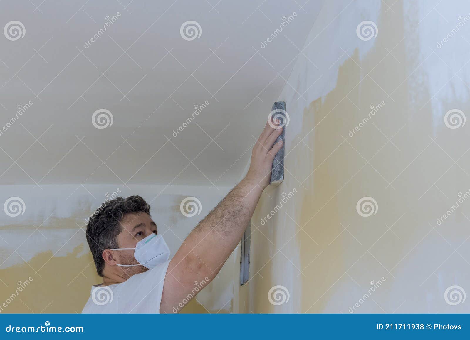 Contractor Using Sand Trowel Sanding the Drywall Stock Photo - Image of ...