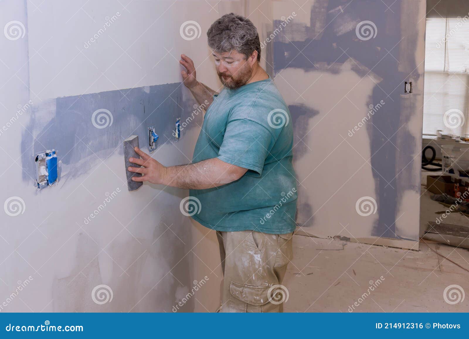 Contractor Using Sand Trowel Sanding the Drywall Stock Photo - Image of ...