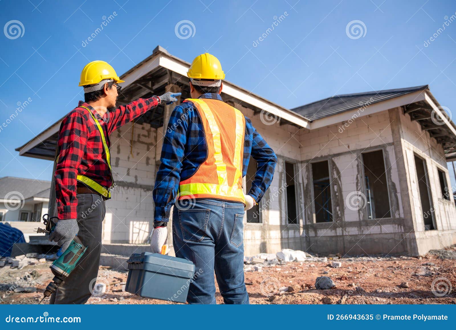 Contractor and Worker Holding Electrician Toolbox at Unfinished House ...