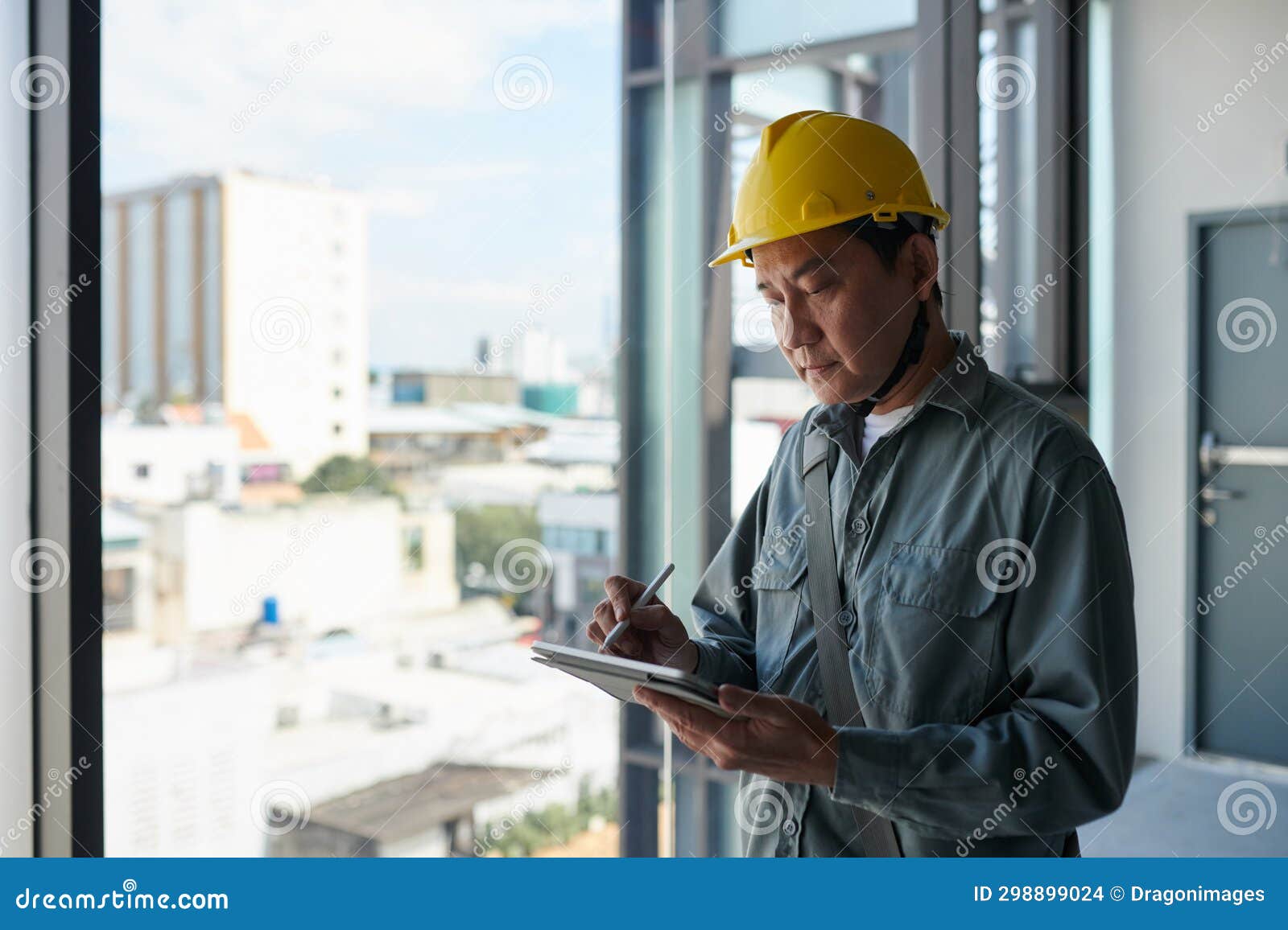 Contractor Working at Construction Site Stock Photo - Image of write ...