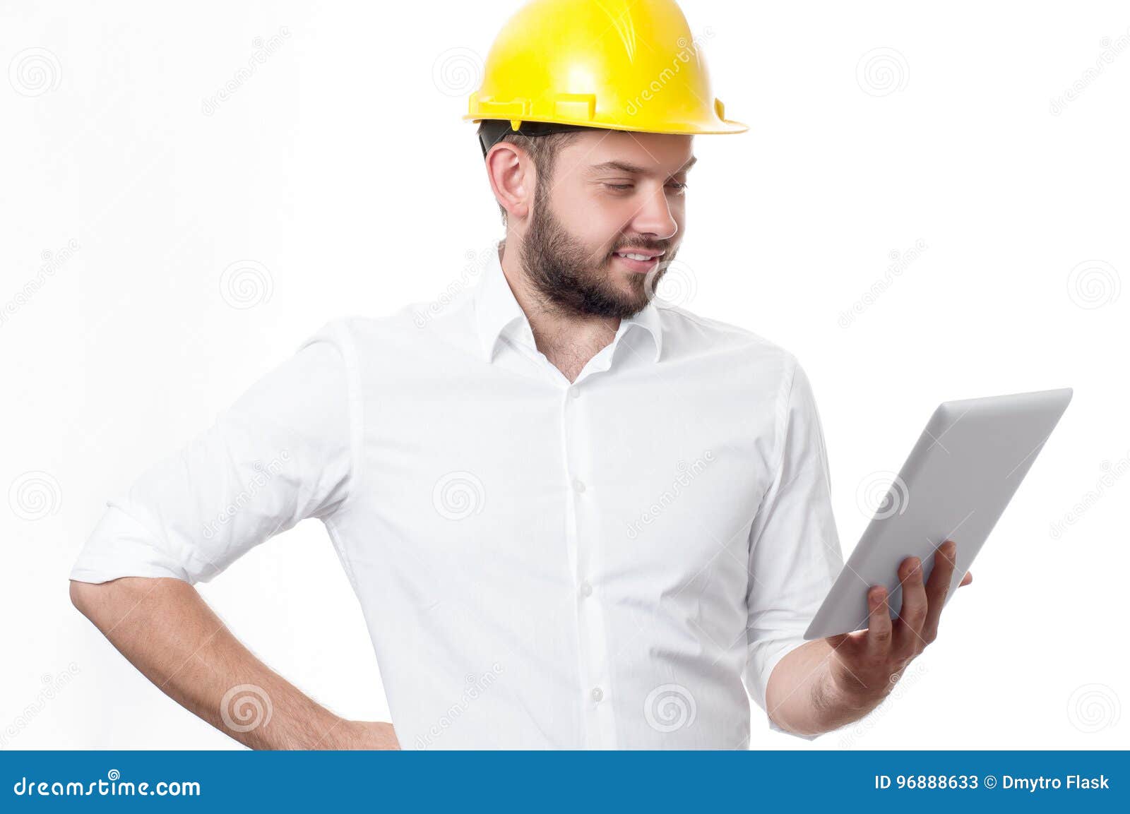 Contractor in Yellow Builder Helmet Working on a Project with Tablet ...