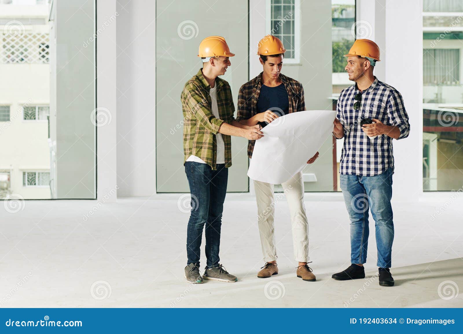 Contractors Discussing Plan Stock Photo - Image of site, adult: 192403634