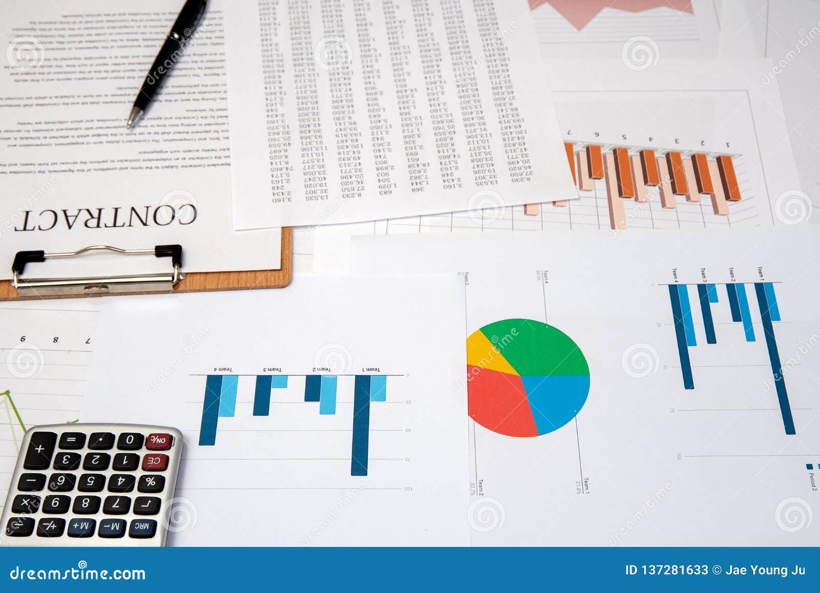 Contracts, Charts, And Graphs On The Desk. Business Desk Concept ...