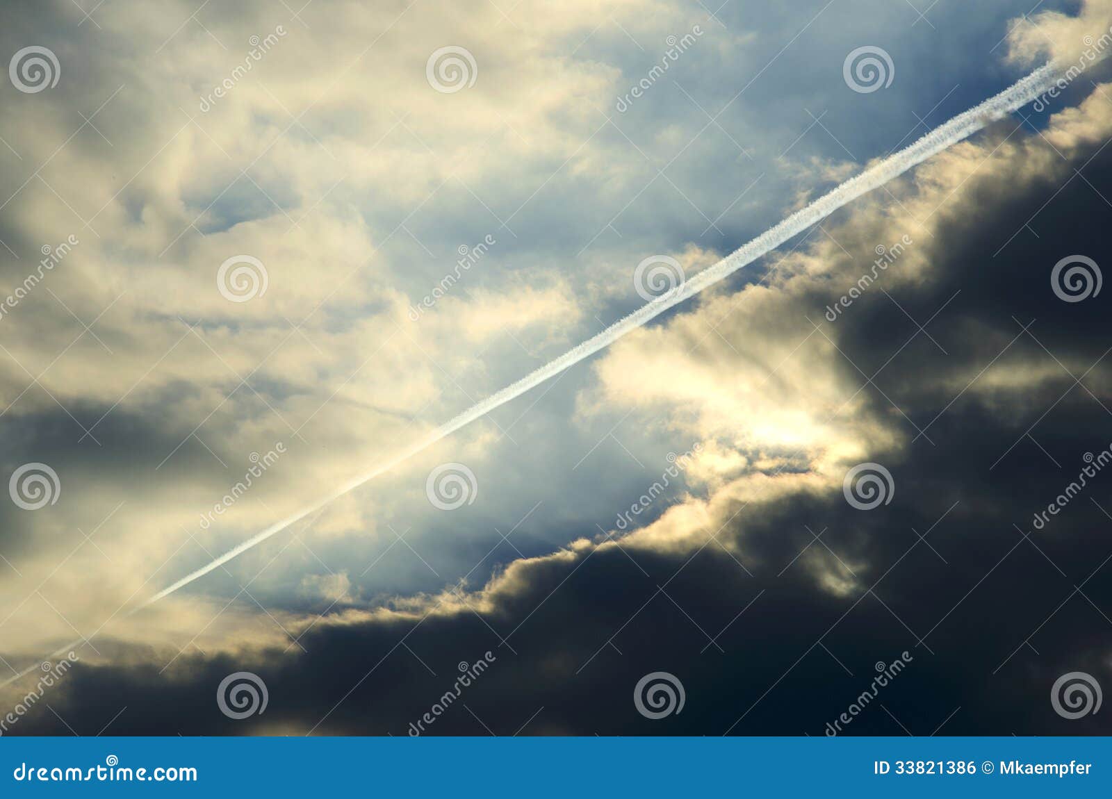 Contrail and clouds stock photo. Image of bright, blue - 33821386