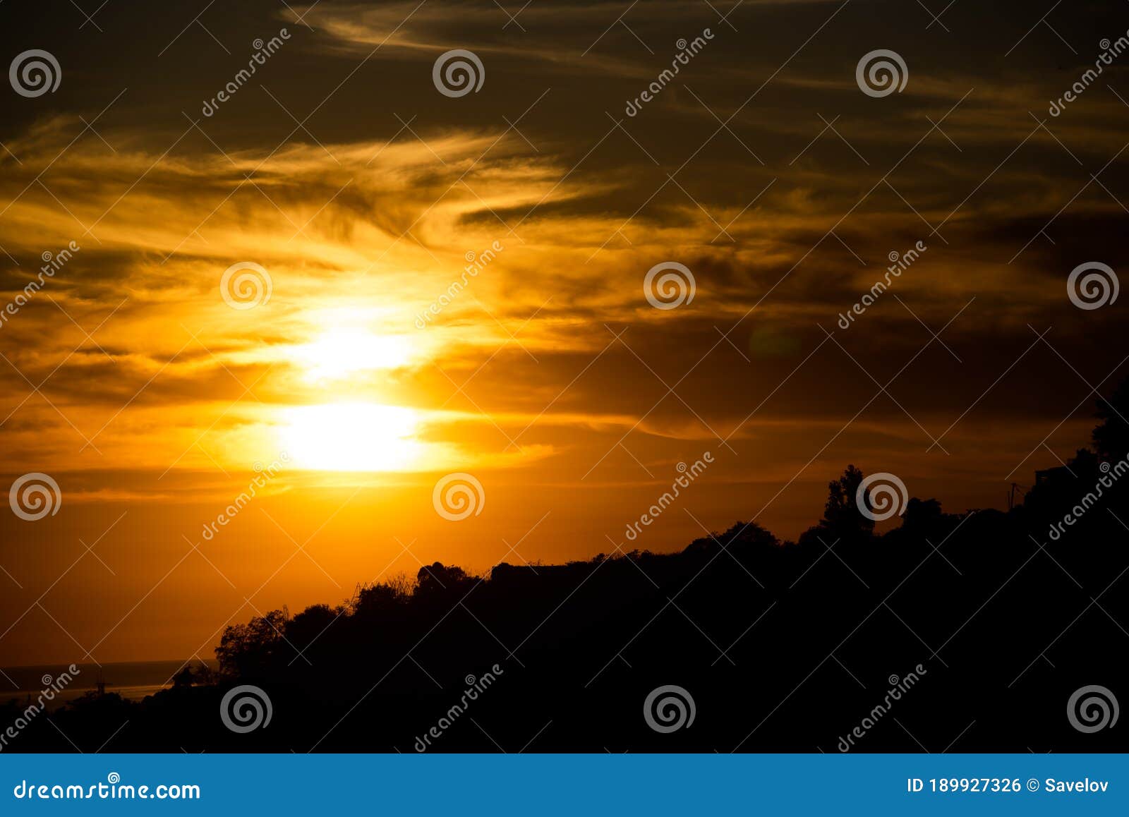 Contrast Background with a Bright Setting Sun and Cloud Stock Photo ...