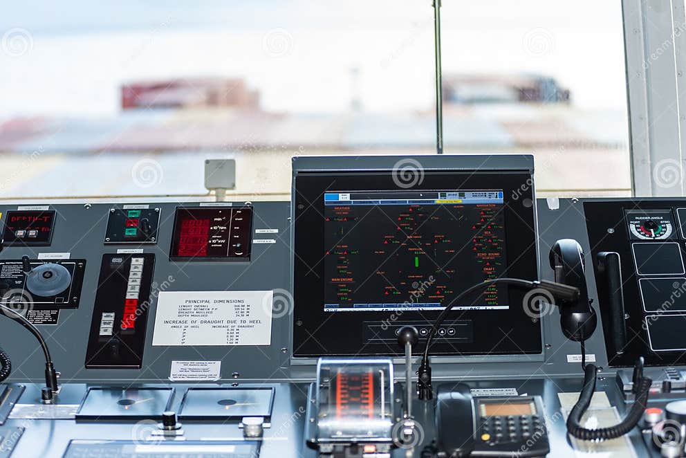 A Control Console Filled with Navigation Instruments Aboard a Large ...