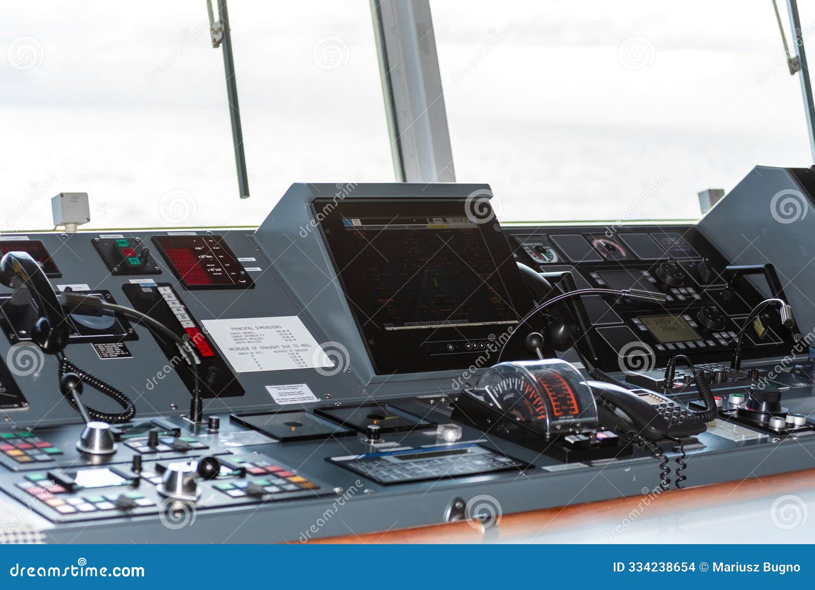 A Control Console Filled with Navigation Instruments Aboard a Large ...