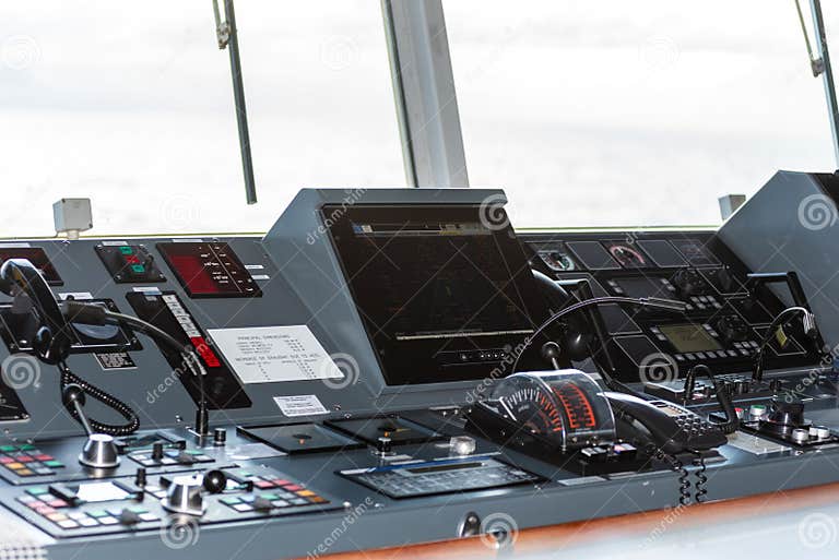 A Control Console Filled with Navigation Instruments Aboard a Large ...