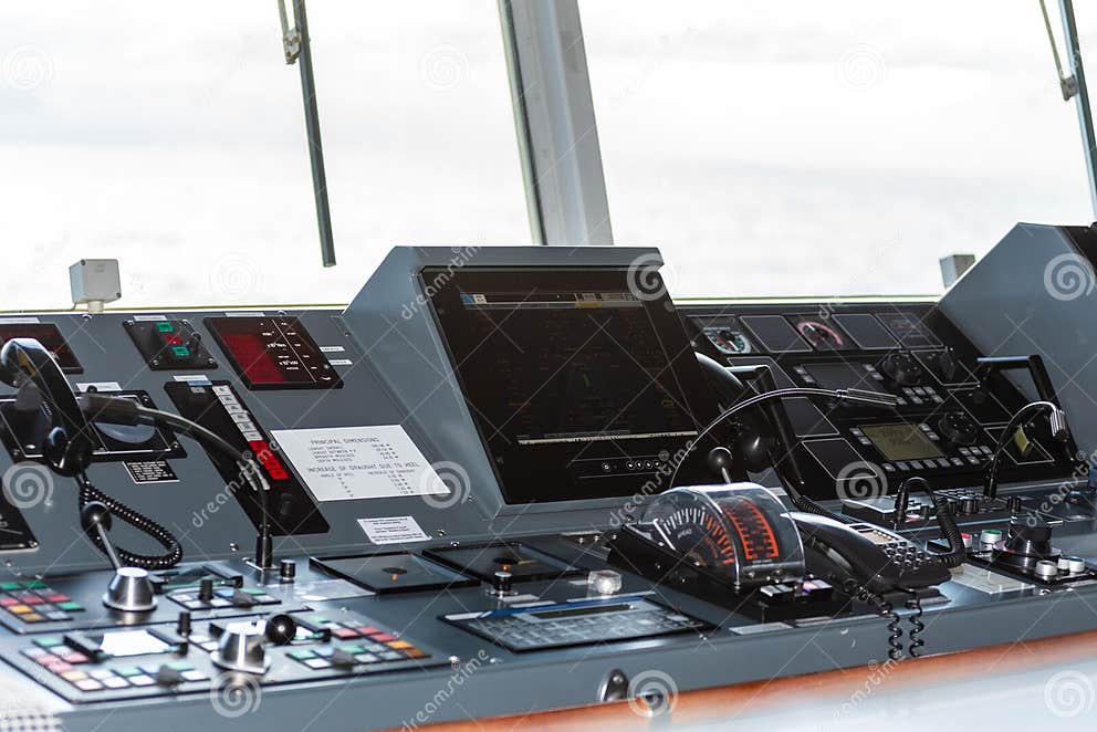A Control Console Filled with Navigation Instruments Aboard a Large ...