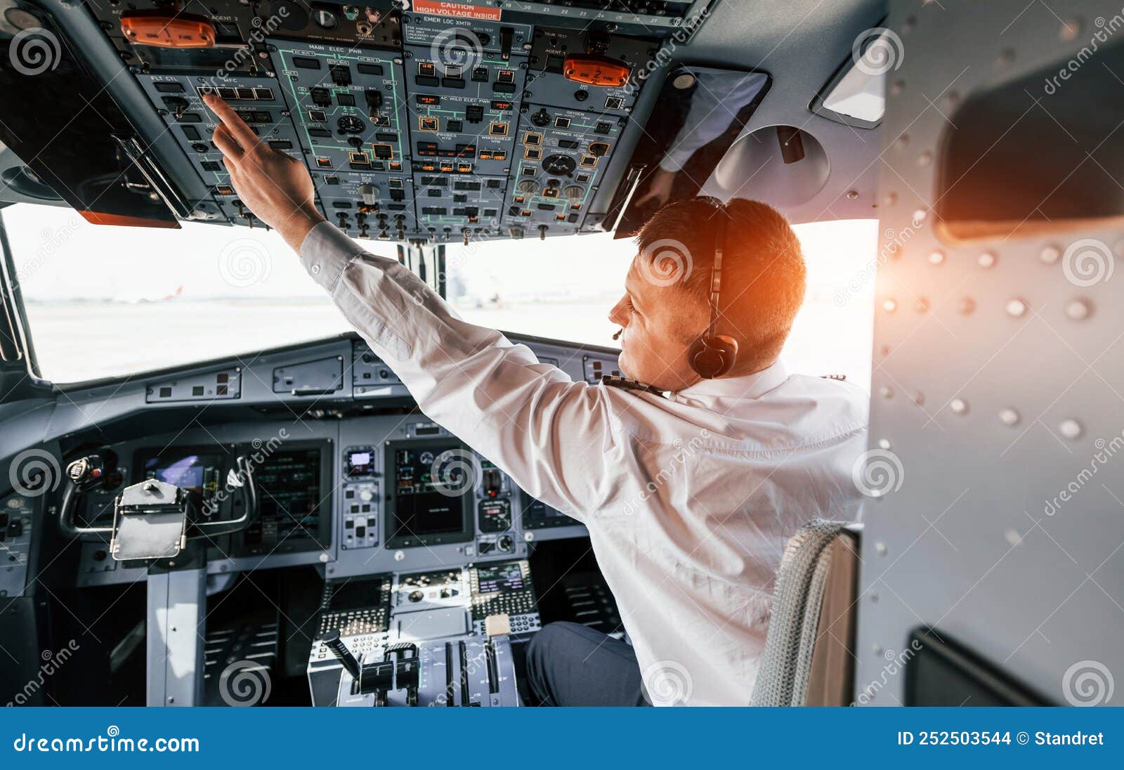 Control of the Flight. Pilot on the Work in the Passenger Airplane ...