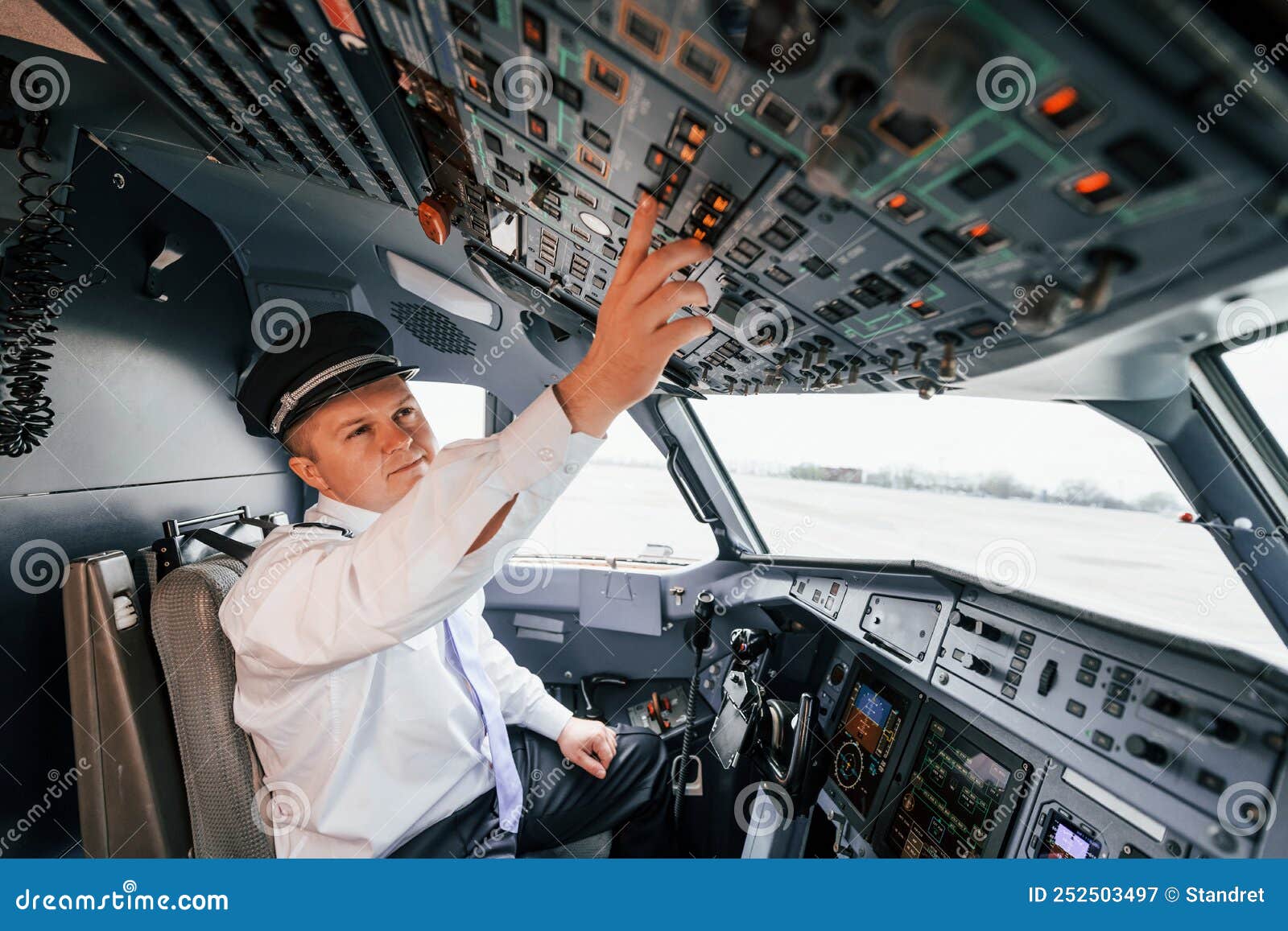 Control of the Flight. Pilot on the Work in the Passenger Airplane ...