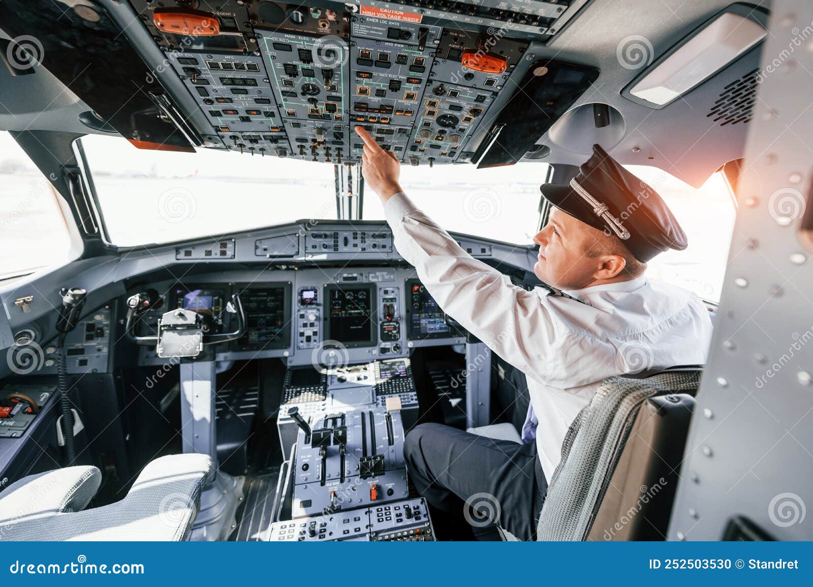 Control of the Flight. Pilot on the Work in the Passenger Airplane ...
