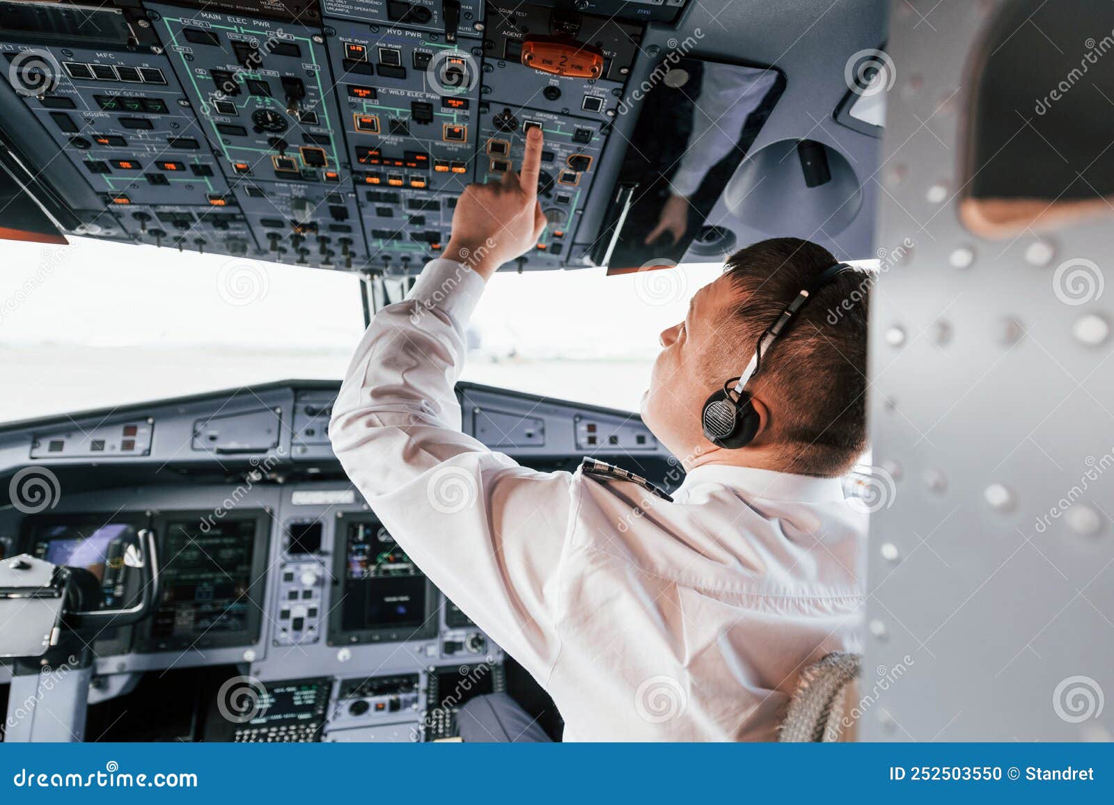 Control of the Flight. Pilot on the Work in the Passenger Airplane ...