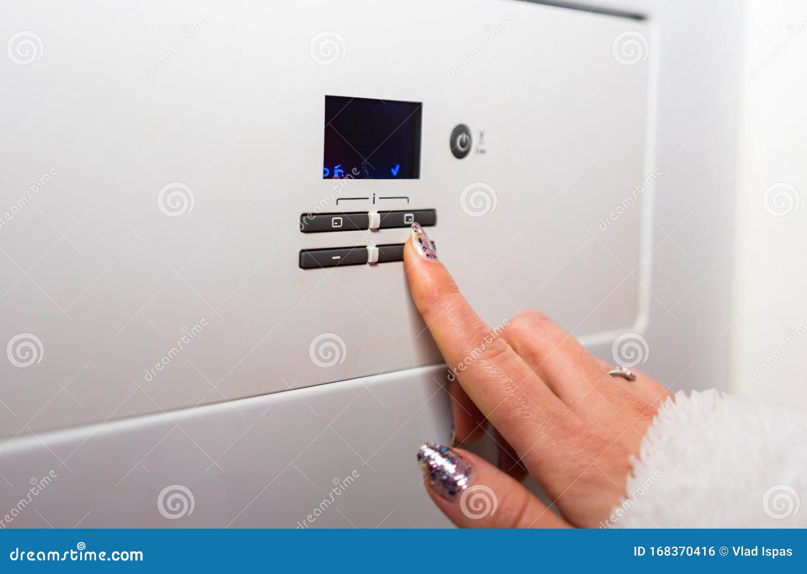 Control Panel of Central Heating. Hand Adjusting the Room Temperature ...