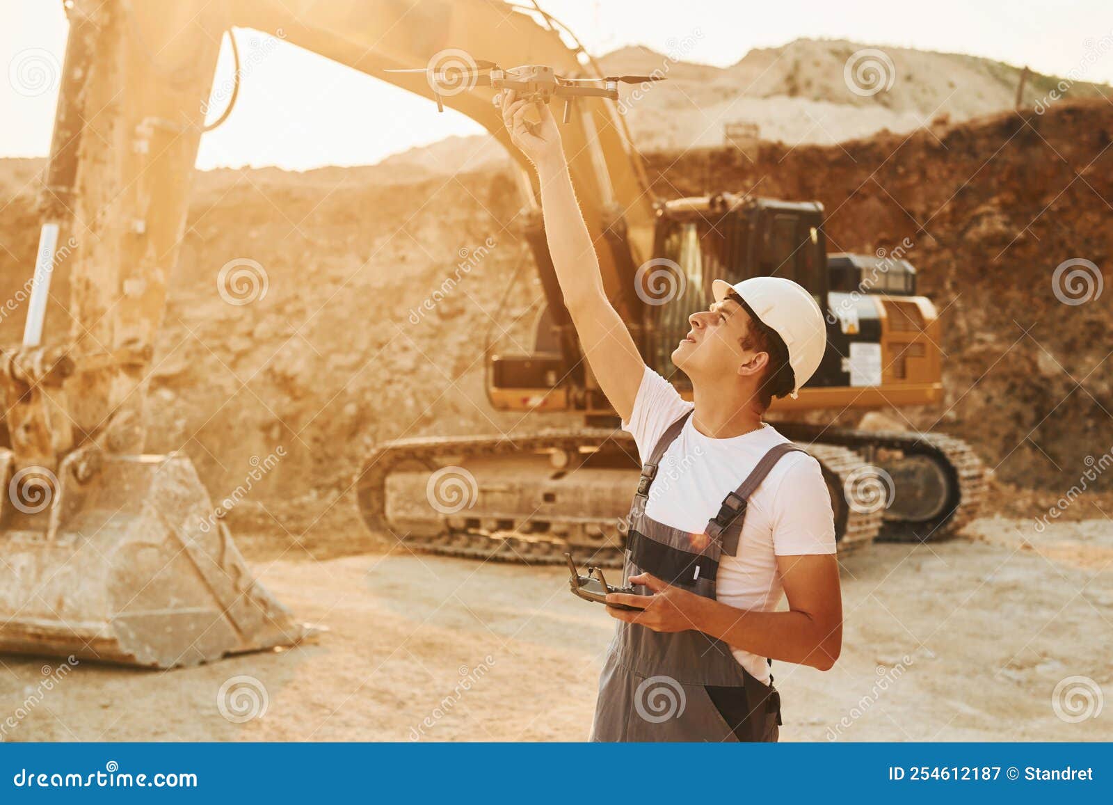 Control of the Project. Worker in Professional Uniform is on the Borrow ...