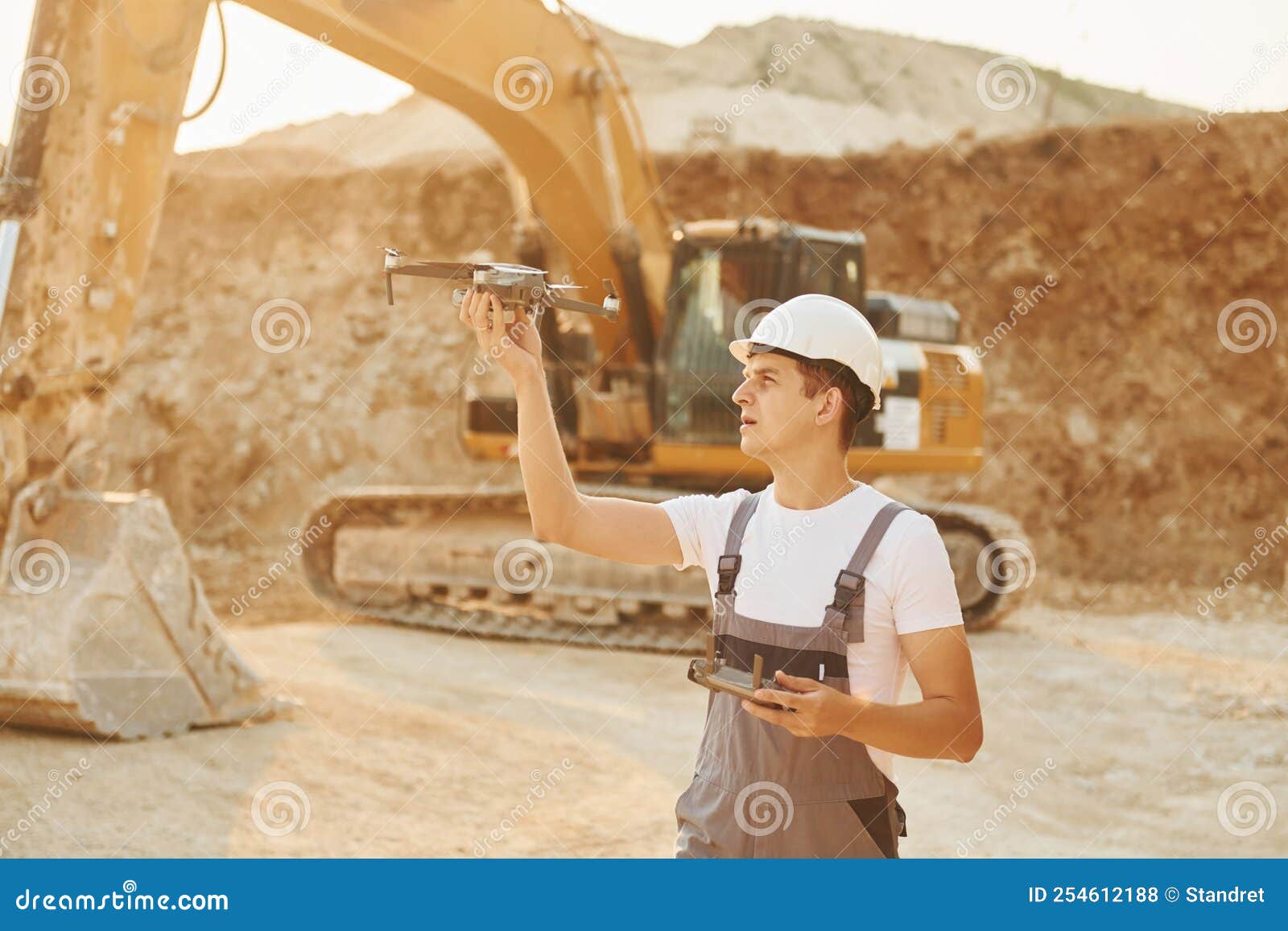Control of the Project. Worker in Professional Uniform is on the Borrow ...