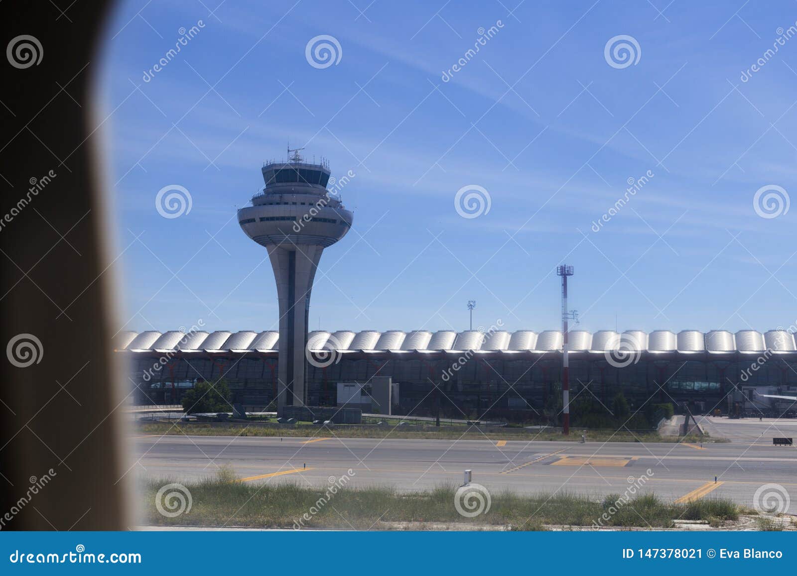 Control Tower and Passengers Terminal View from a Window Plane. Daytime ...