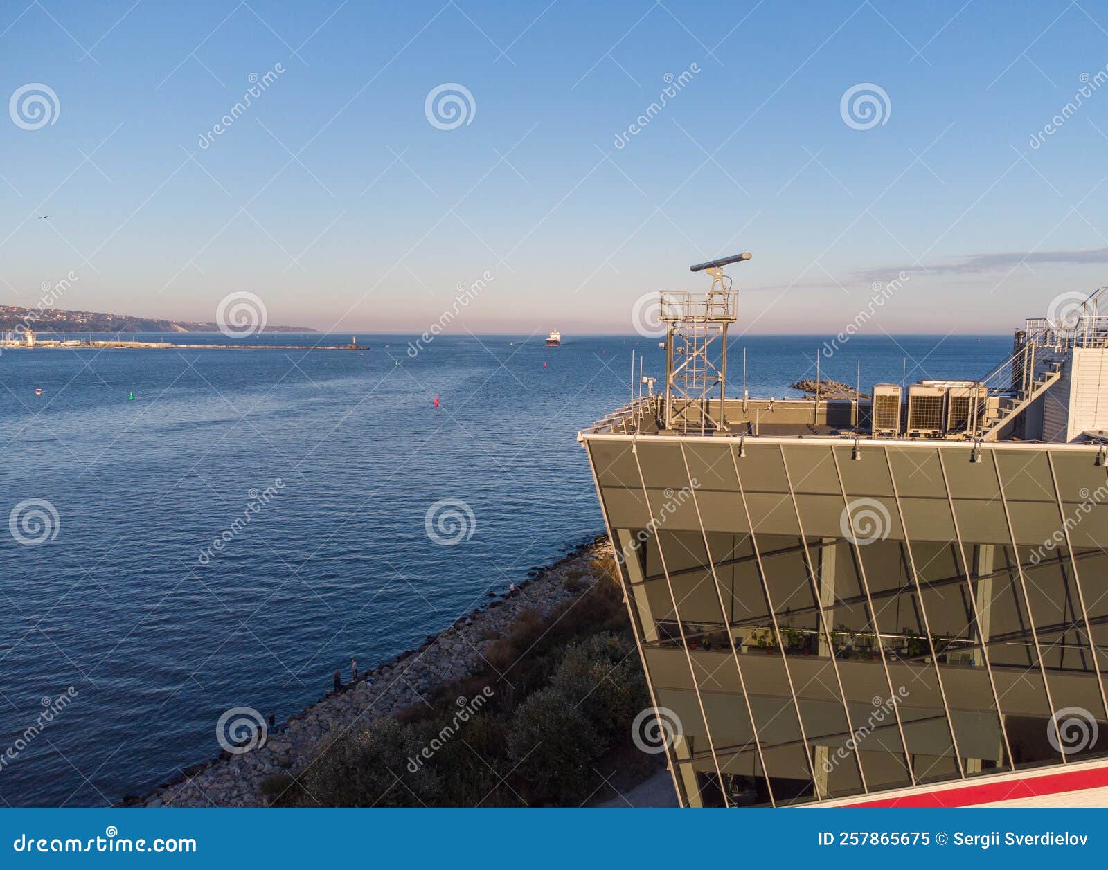 Control Tower of Ships with Big Cargo Ship Entering the Port at the ...