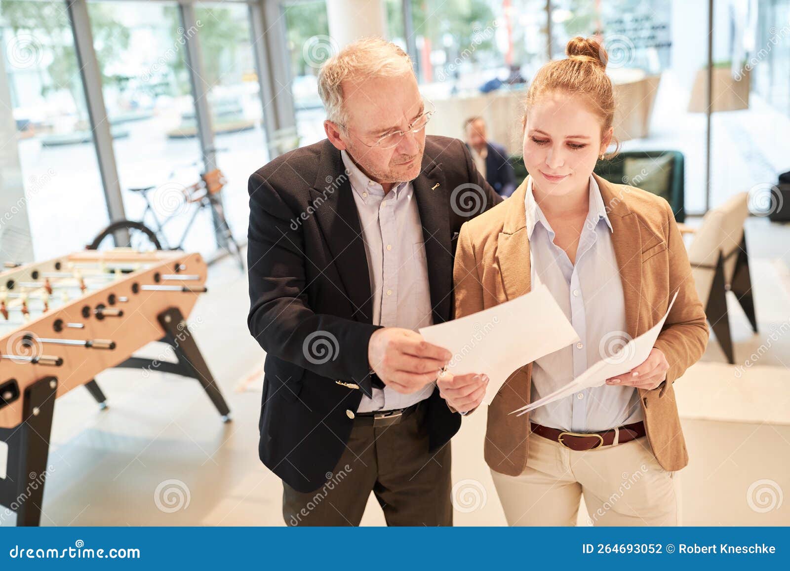 Controller and Young Businesswoman Checking Business Documents Stock ...