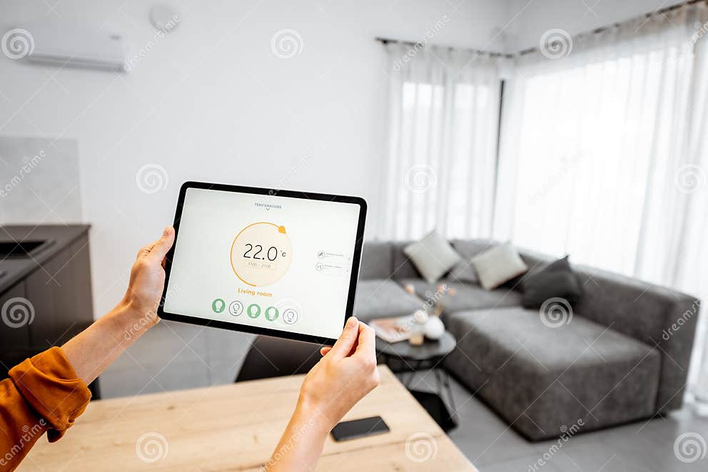 Controlling Heating with a Digital Tablet at Home Stock Photo - Image ...
