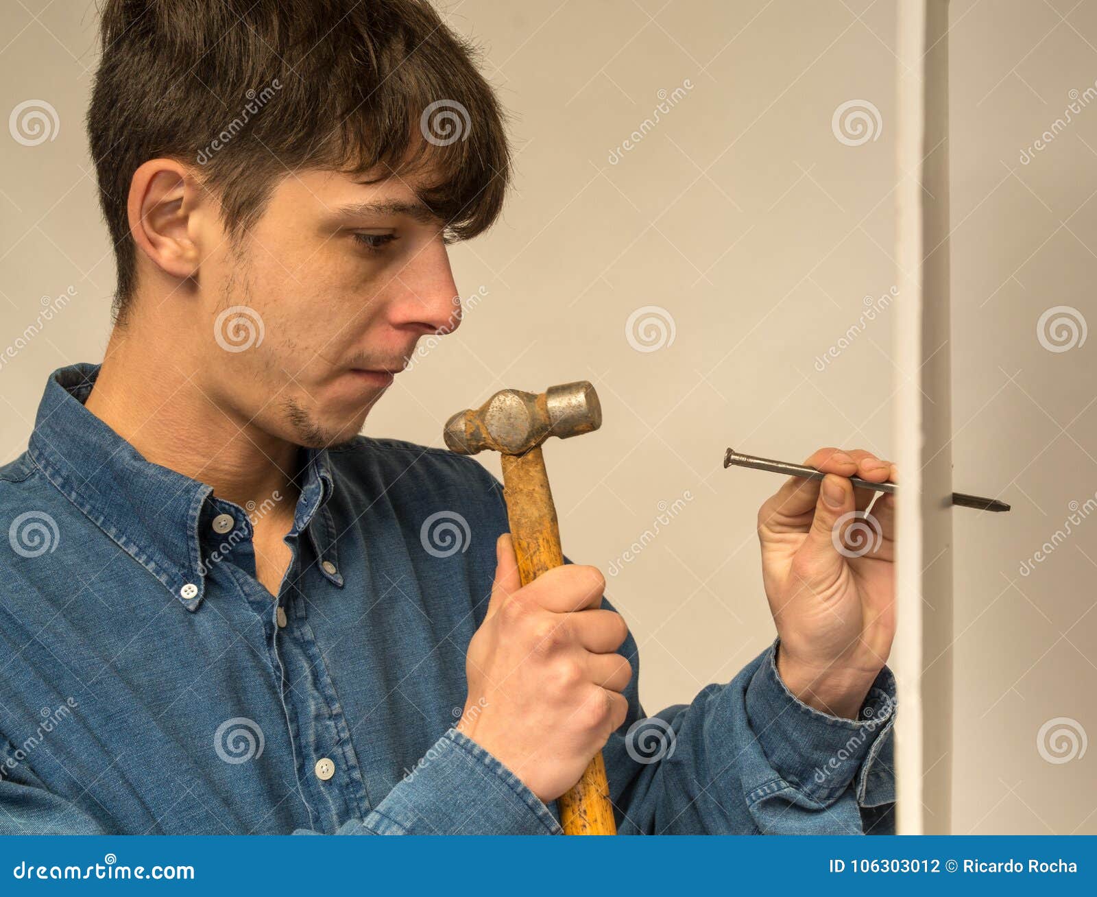 Contruction Worker Hamming a Nail Stock Photo - Image of improvement ...