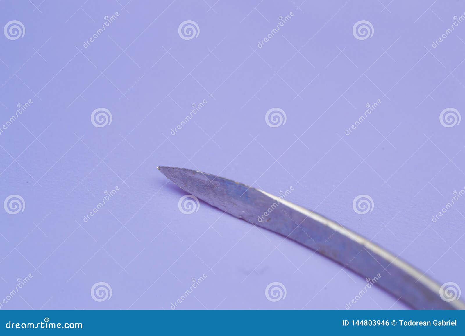 Conventional Cutting Needle Used in Surgery on Blue Background Stock ...