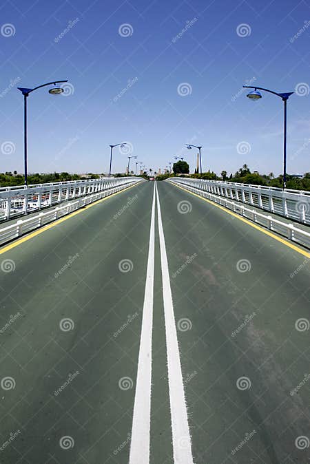 Converging Lines of Road on Bridge Stock Photo - Image of blue, travel ...