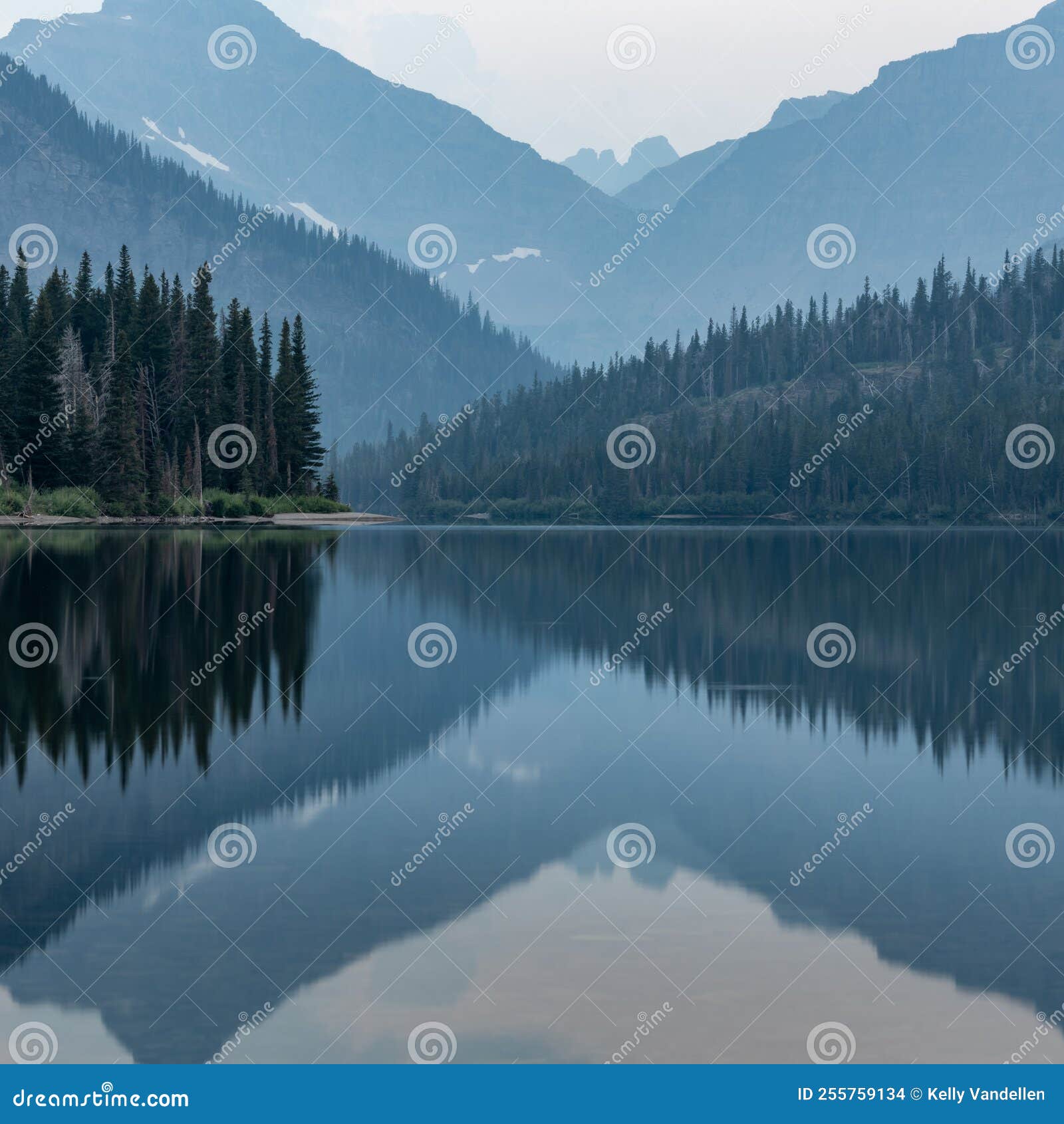 Converging Ridges with Glacier Mountains Over Lake Stock Photo - Image ...