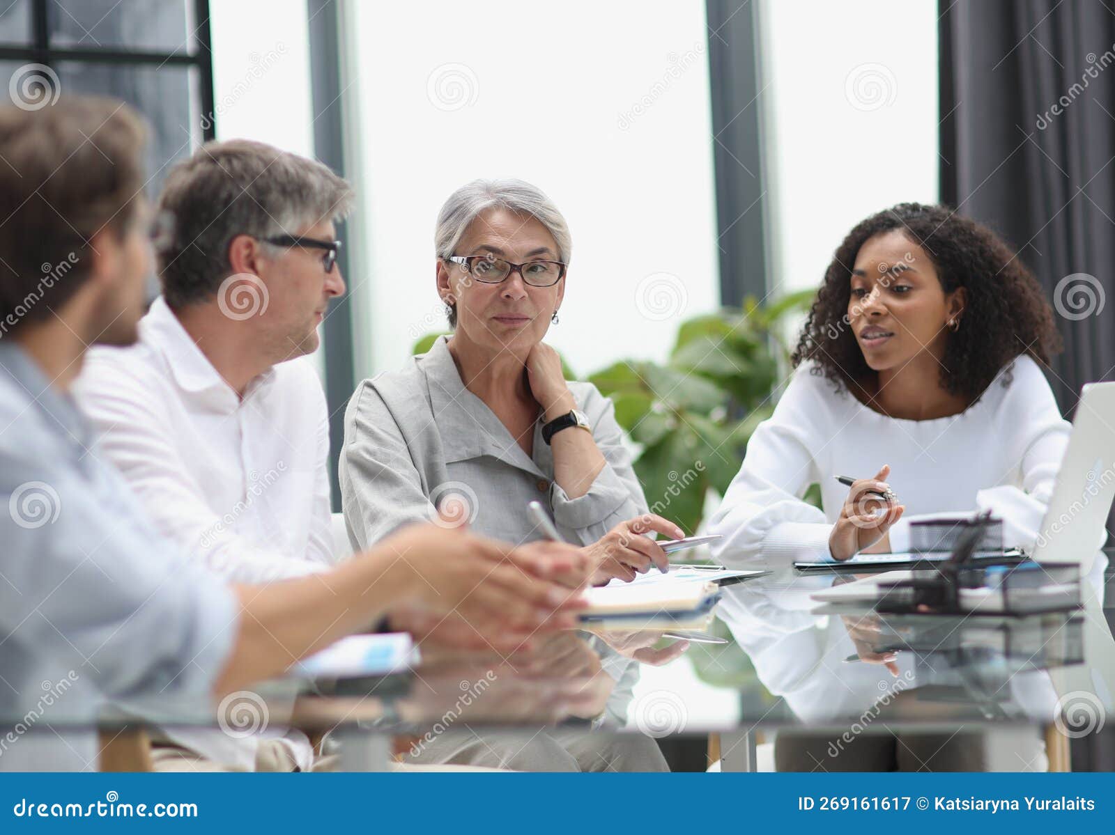 Conversation between Managers and Employees in the Office at the Table ...