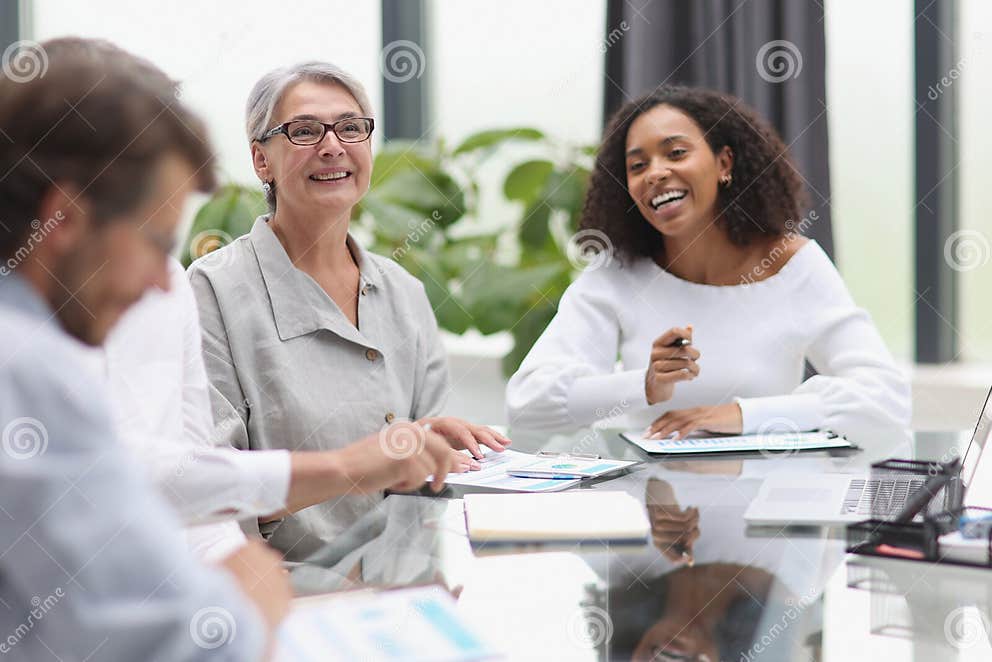 Conversation between Managers and Employees in the Office at the Table ...