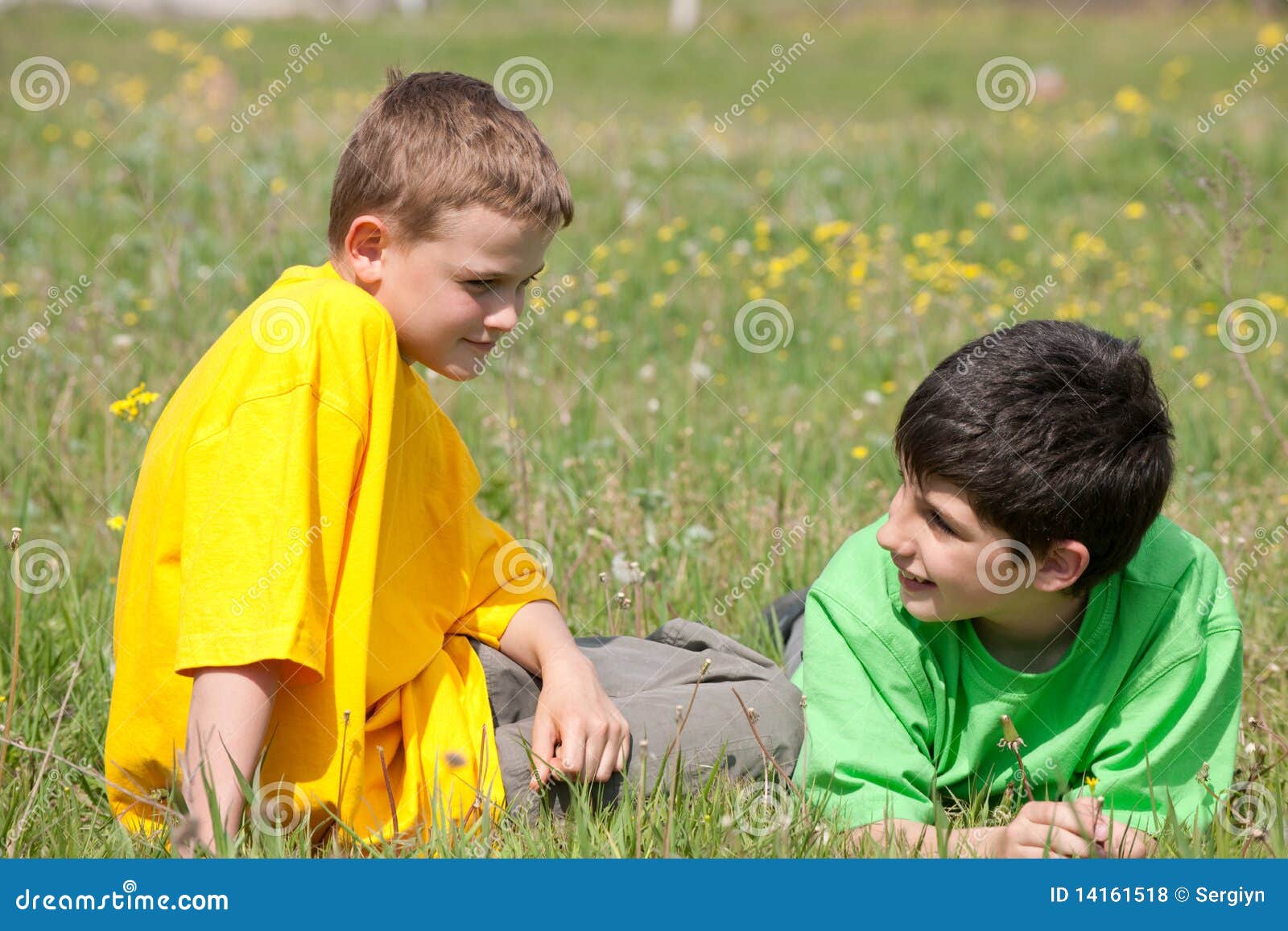 Conversation of Two Boys on the Grass Stock Photo - Image of confident ...