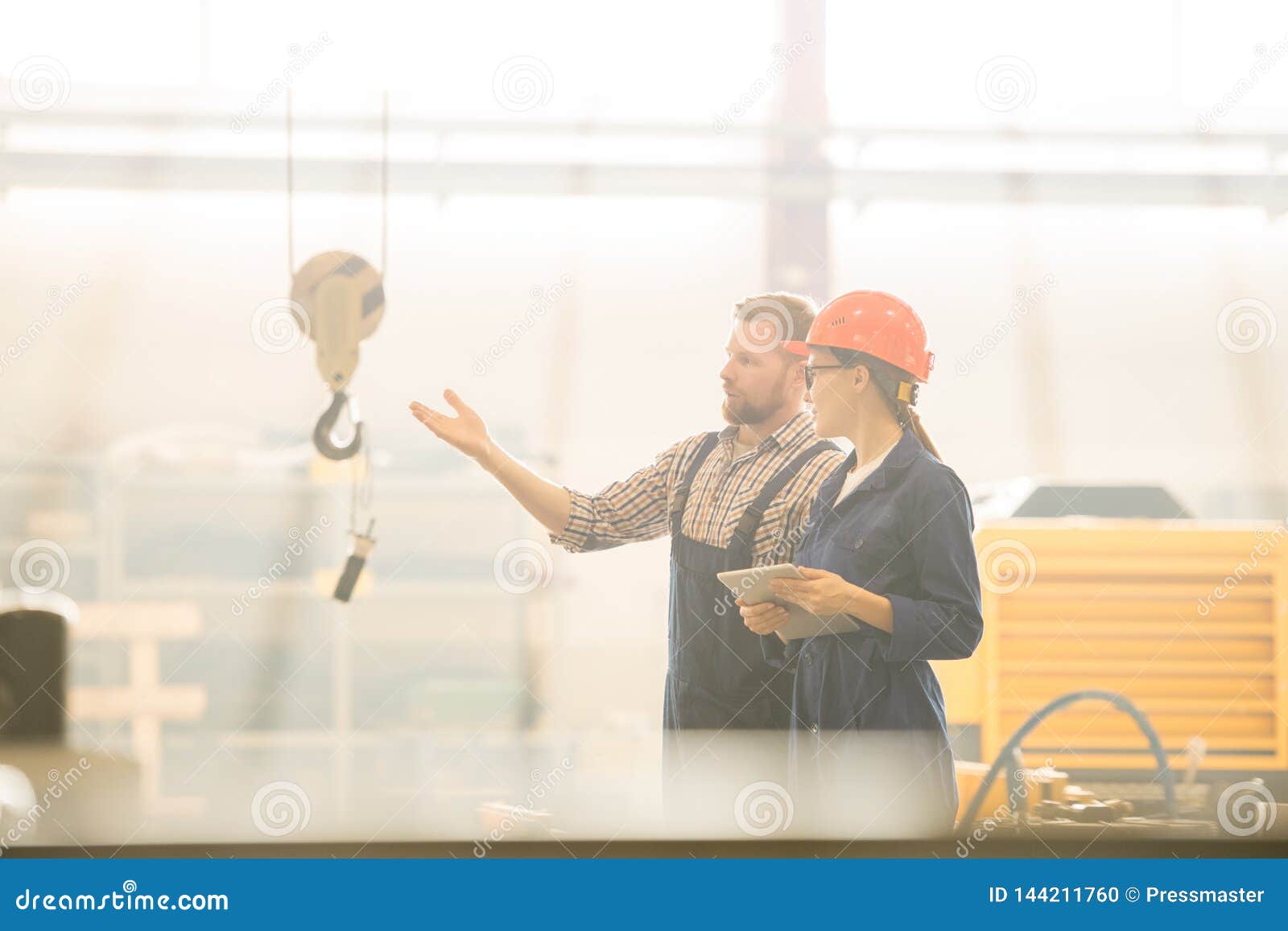 Conversation in workshop stock photo. Image of explaining - 144211760