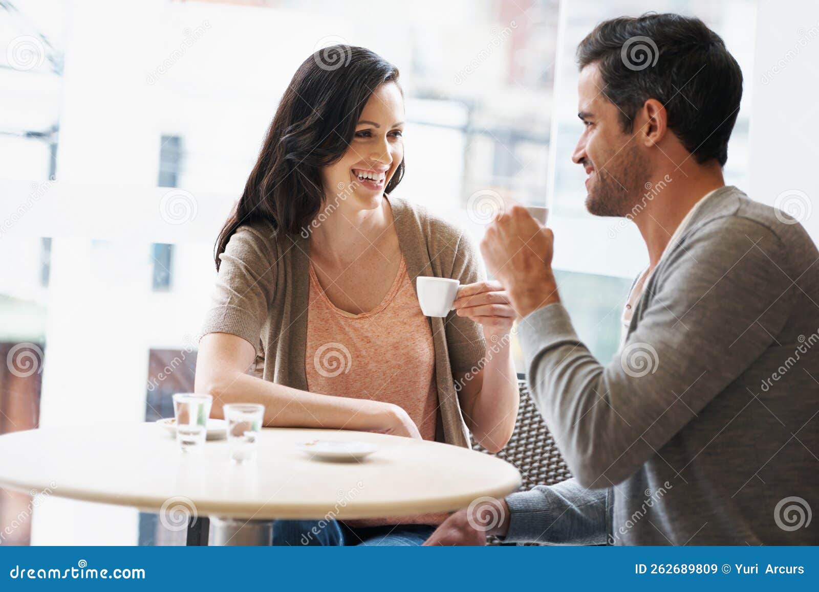 Conversations Over Some Coffee. a Young Couple Grabbing a Cup of Coffee ...
