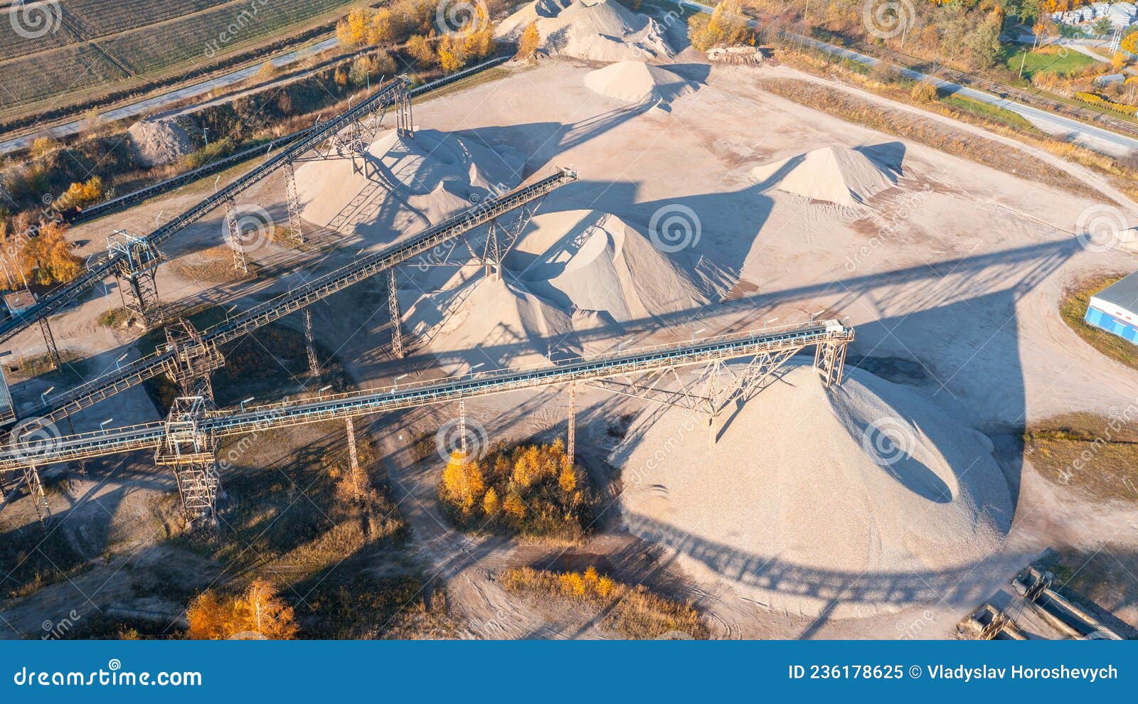 Conveyor Belts Unload a Lot of Stone, Large Piles of Stone in a Quarry ...