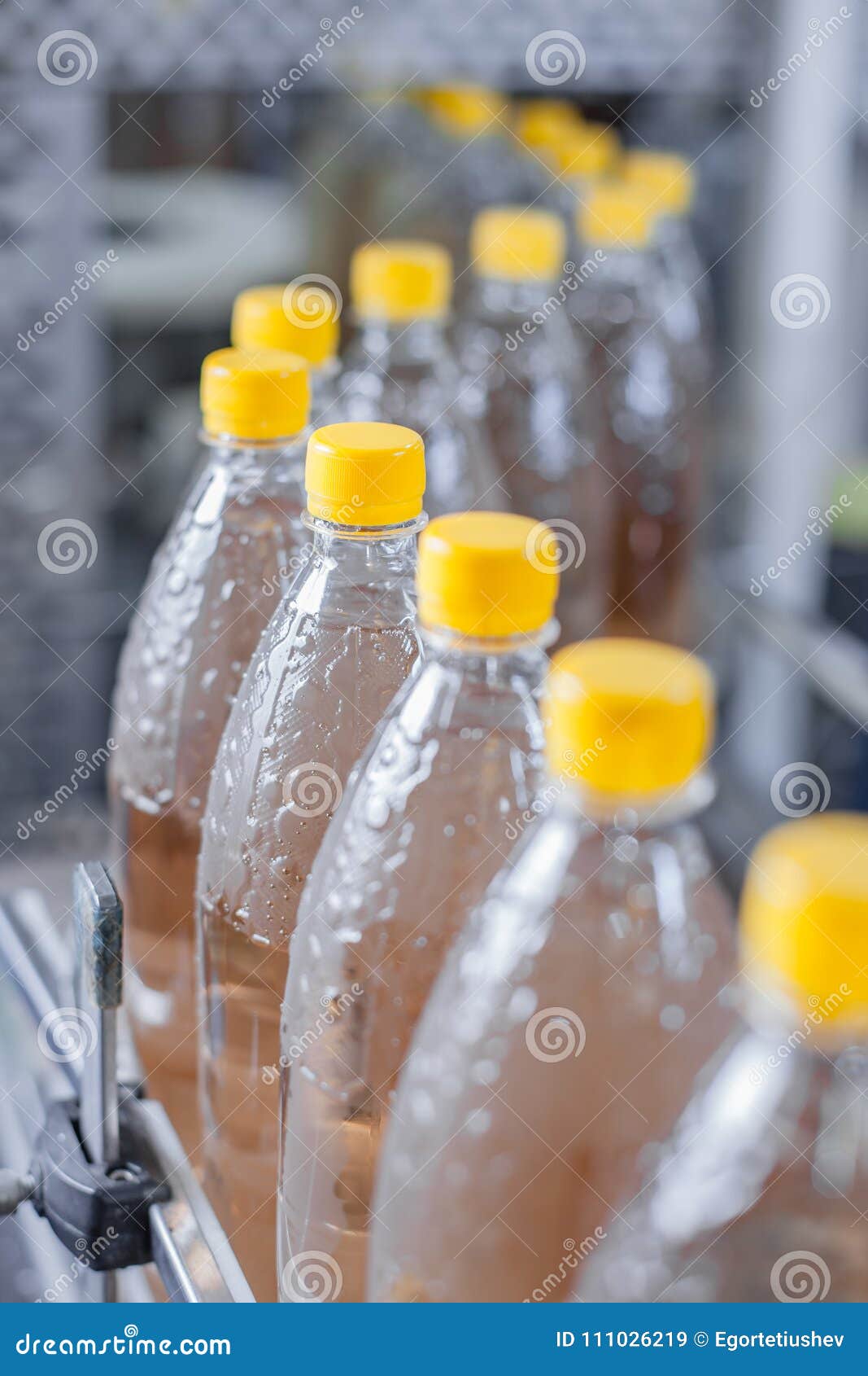 Conveyor with fizzy water stock image. Image of aqua - 111026219