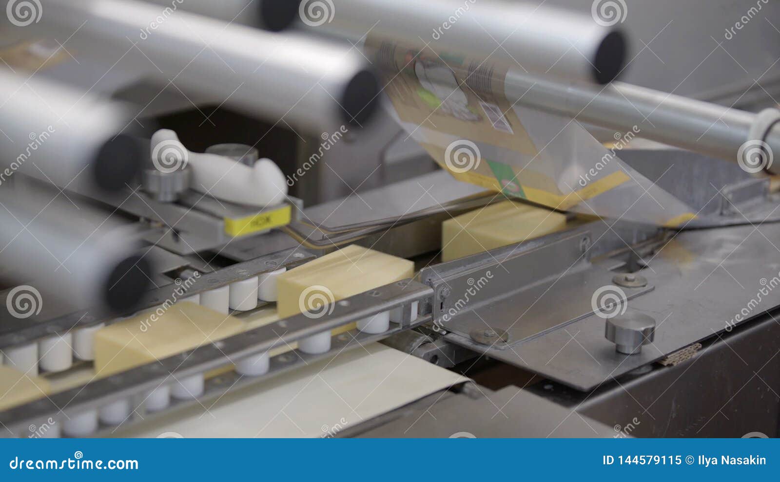 Conveyor Line for Cheese Packaging Process. Close Up of Cheese ...