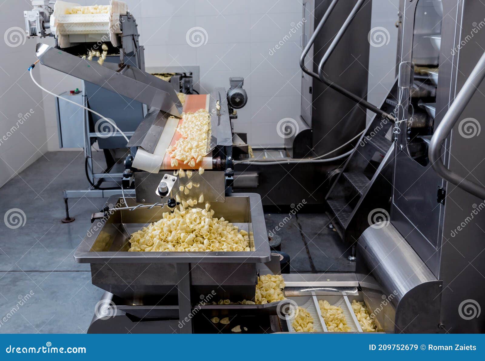 Conveyor Line for Frying Snacks and Chips in a Modern Factory Stock ...
