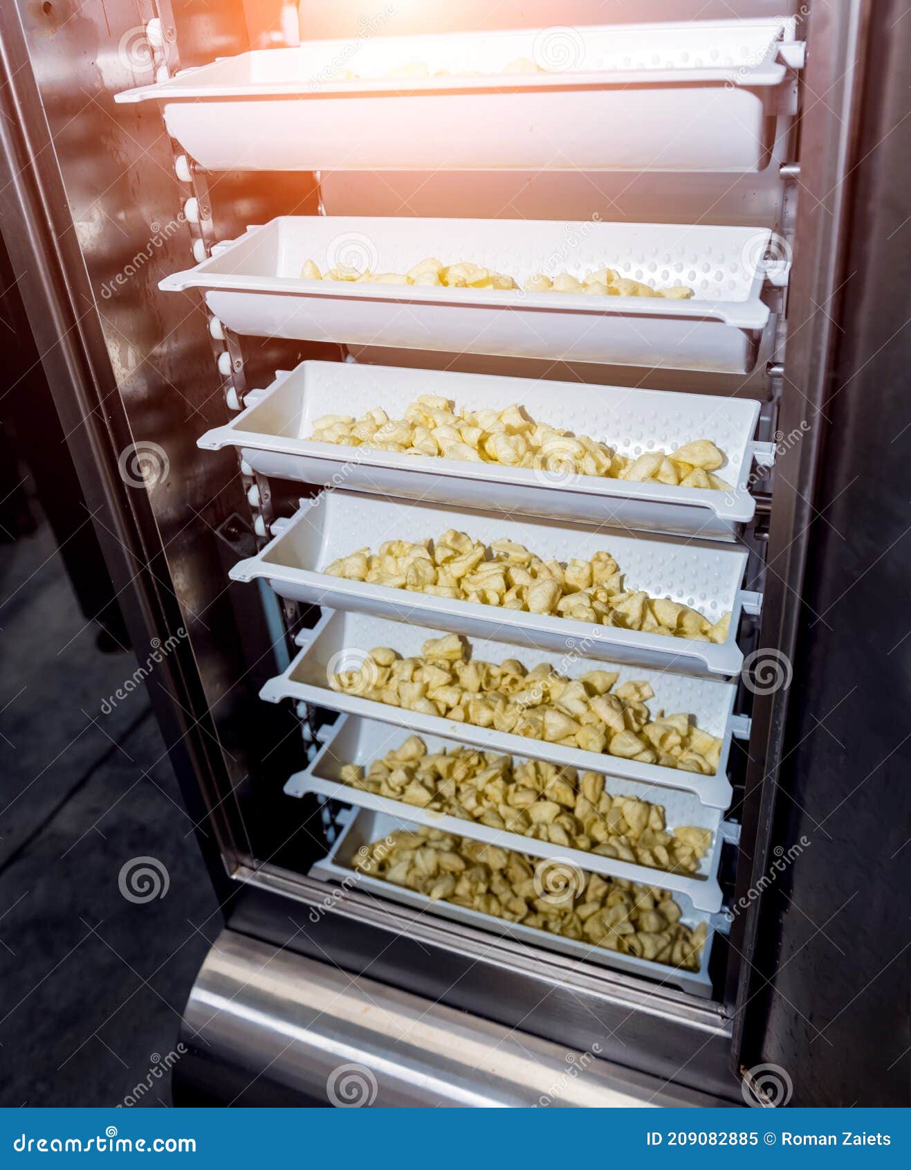 Conveyor Line for Packing Snacks and Chips in a Modern Factory Stock ...